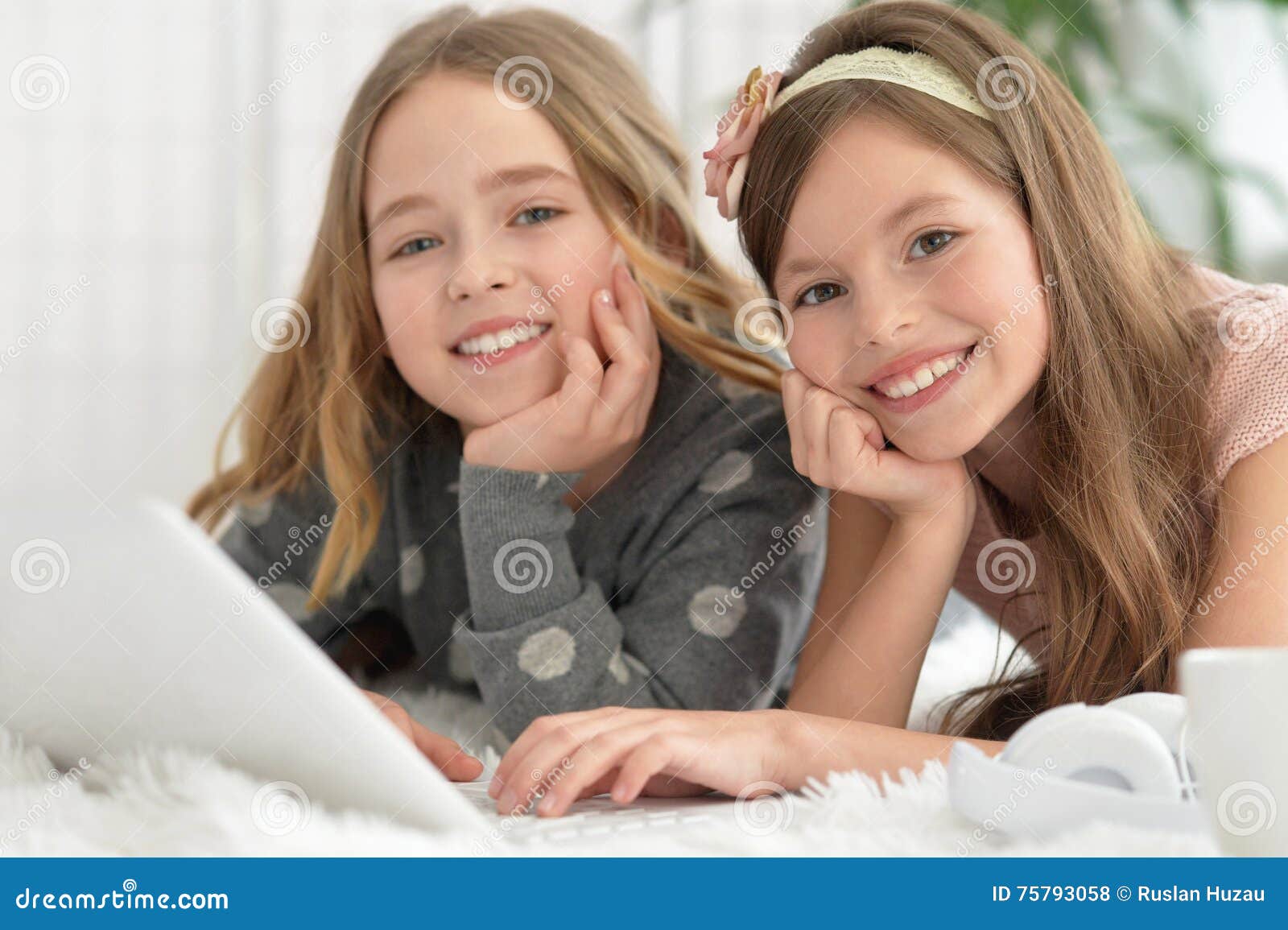 Cute girls in with laptop stock photo. Image of indoor - 75793058