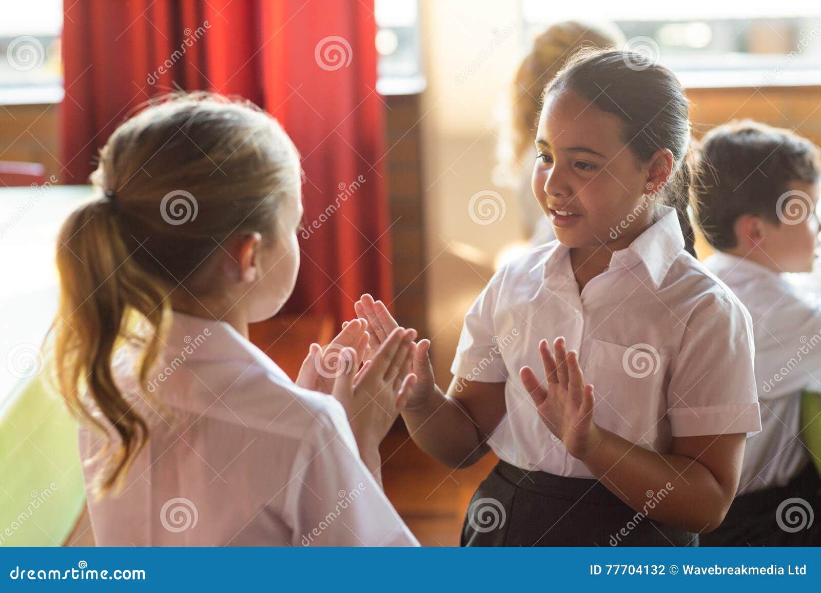 Cute Girls Playing Clapping Game Stock Photo - Image of motion ...