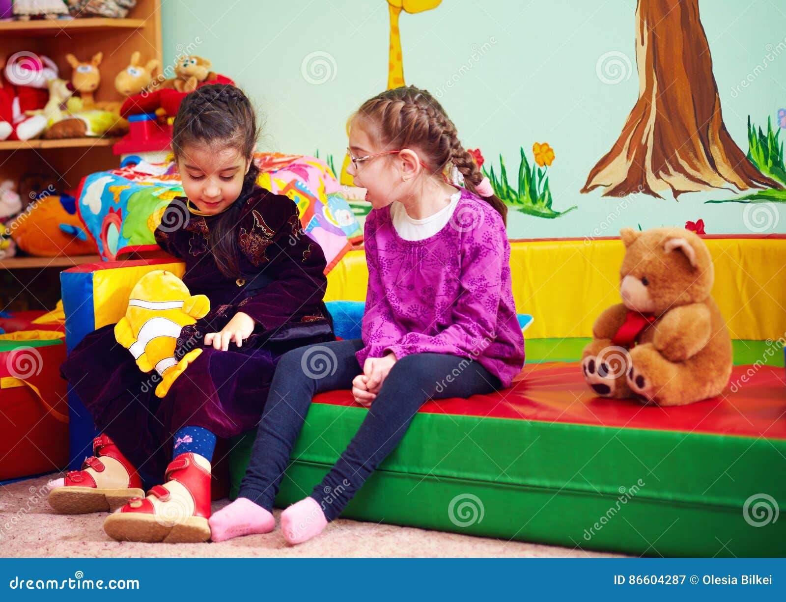 Cute Girls Talking and Playing in Kindergarten for Kids with Special ...