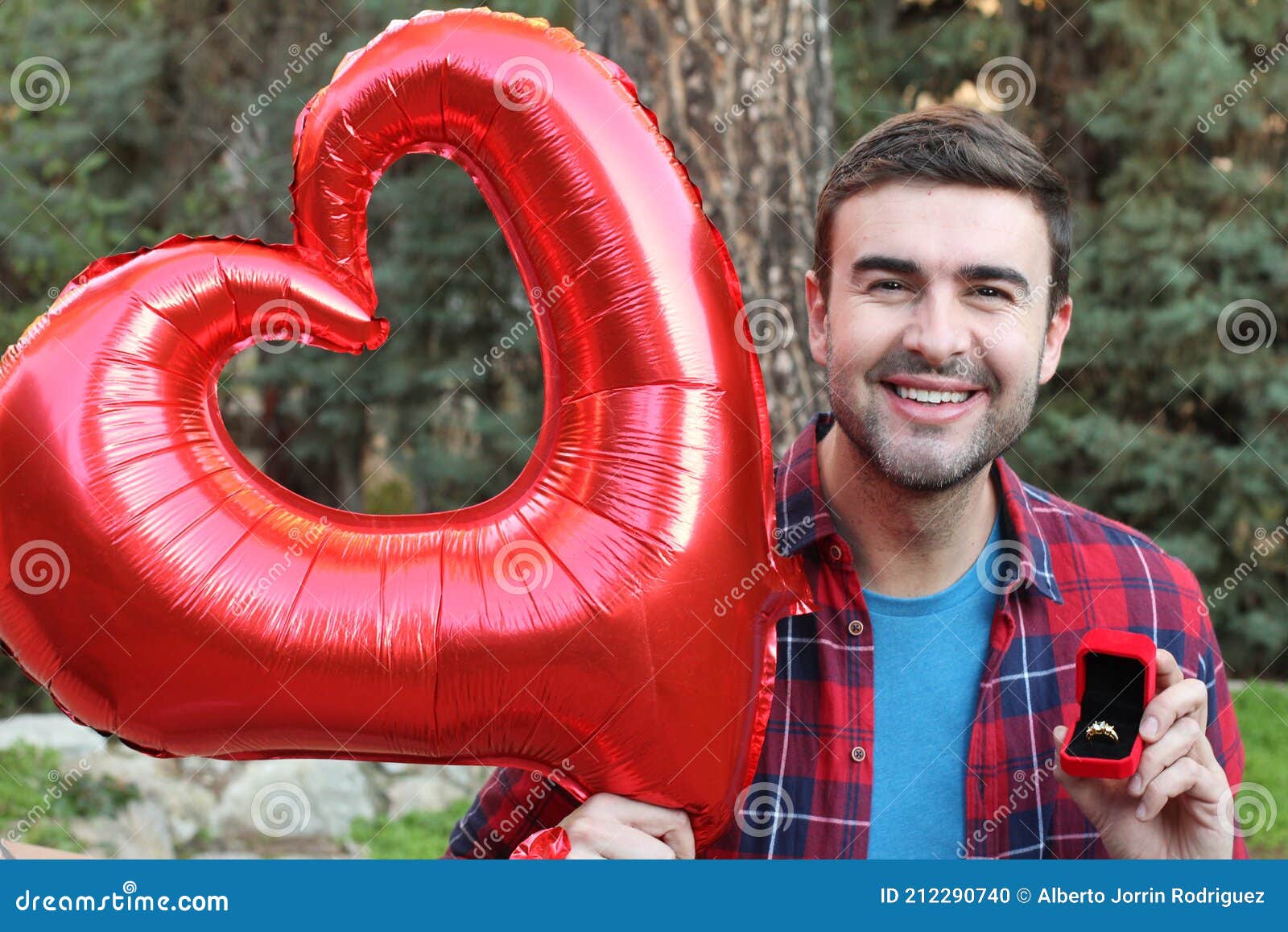 Cute Guy Proposing with Heart Balloon Stock Photo - Image of couple ...