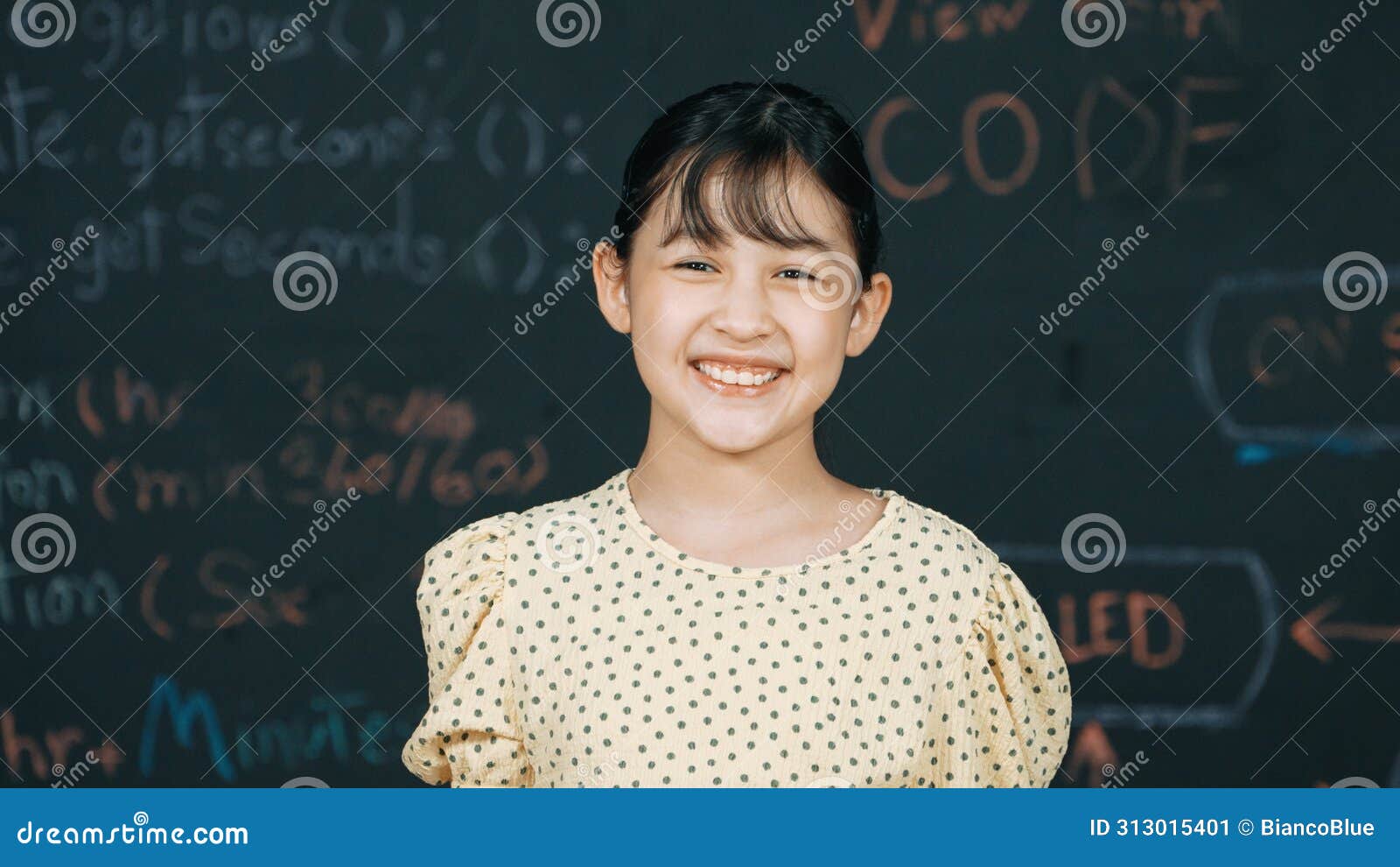 Cute Happy Girl Smiling To Camera while Standing at Blackboard ...