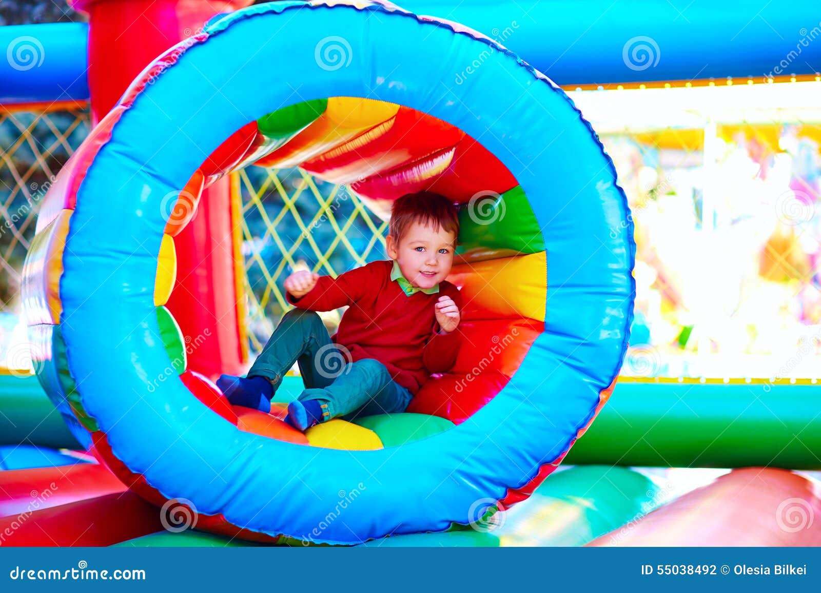 Cute Happy Kid, Boy Playing in Inflatable Attraction on Playground ...