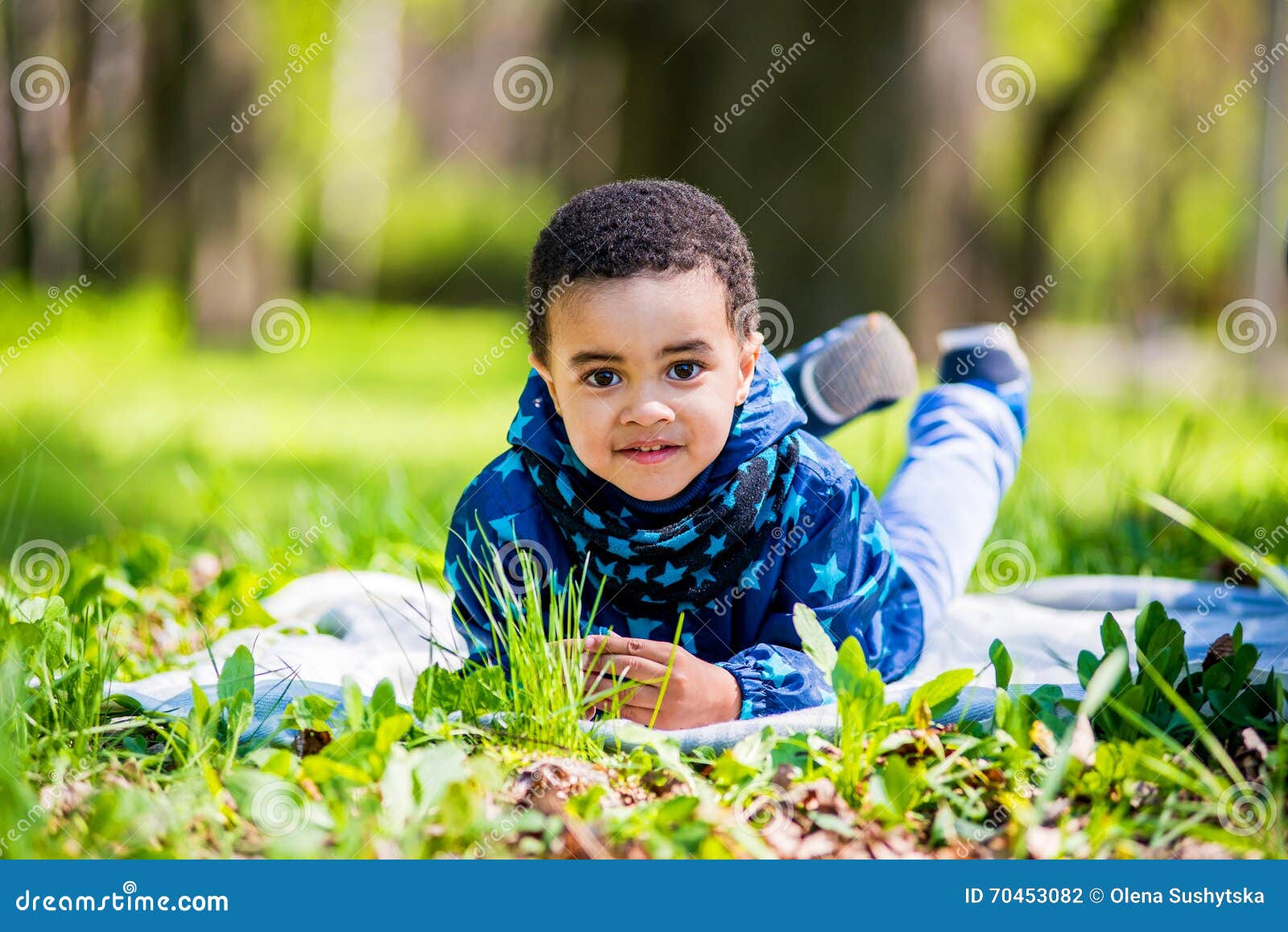 Cute Happy Little Boy Lying in Green Grass on Spring Stock Photo ...