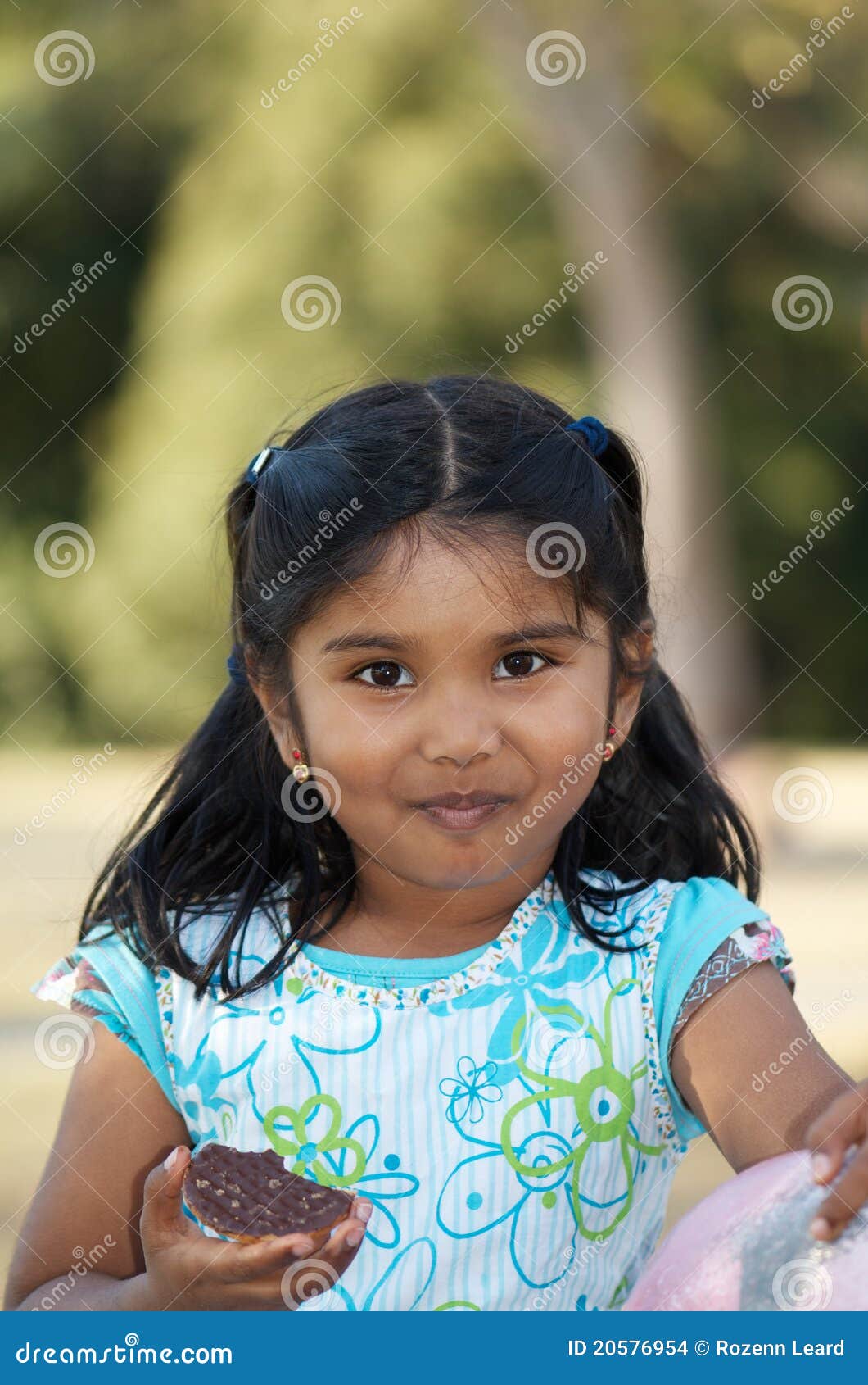Cute Indian Child Eating Biscuit Stock Photo - Image of girl, smile ...