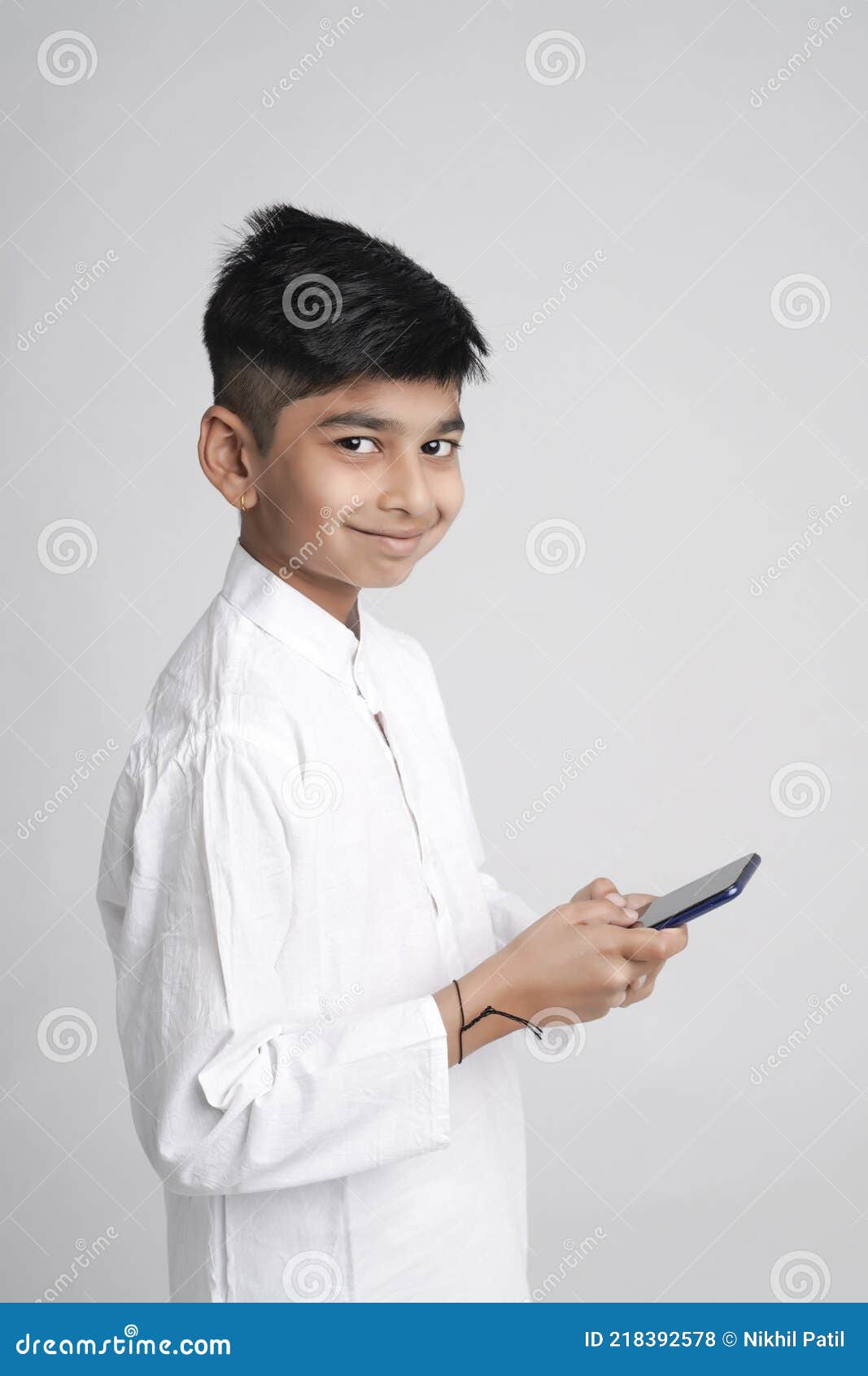Cute Indian Little Boy Using Smart Phone Stock Photo - Image of ...