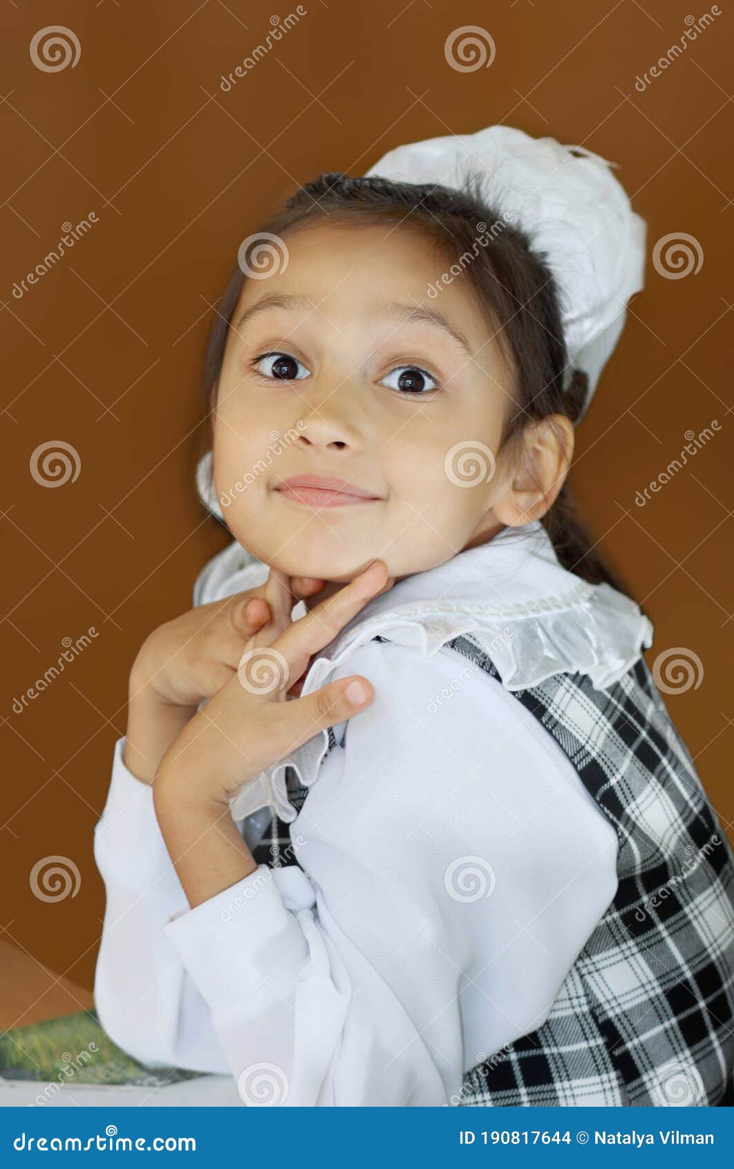 A Cute Joyful Girl with a White Bow, a Student of the First Grade of ...