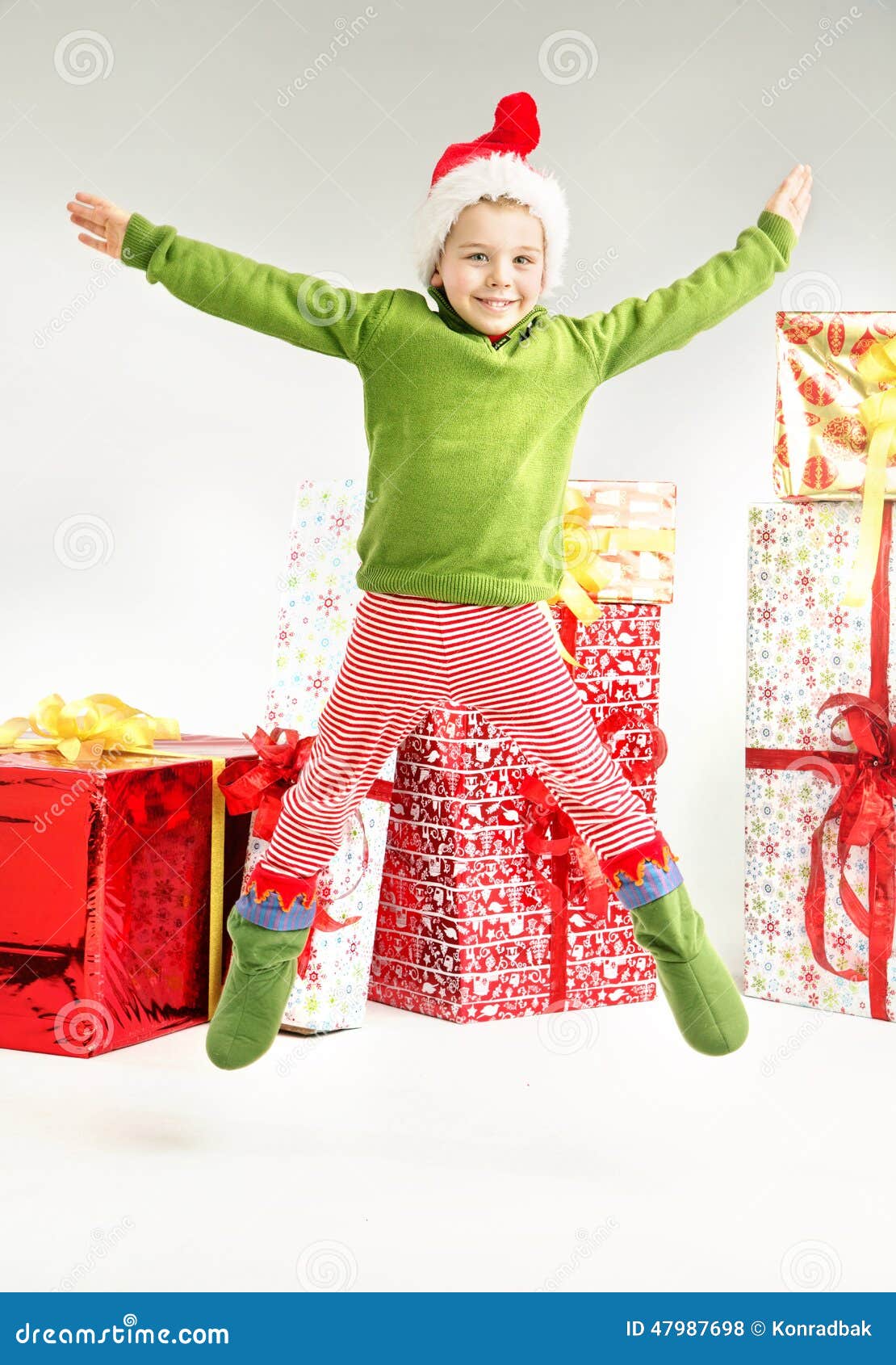 Cute Jumping Elf with Presents in the Bacground Stock Photo - Image of ...