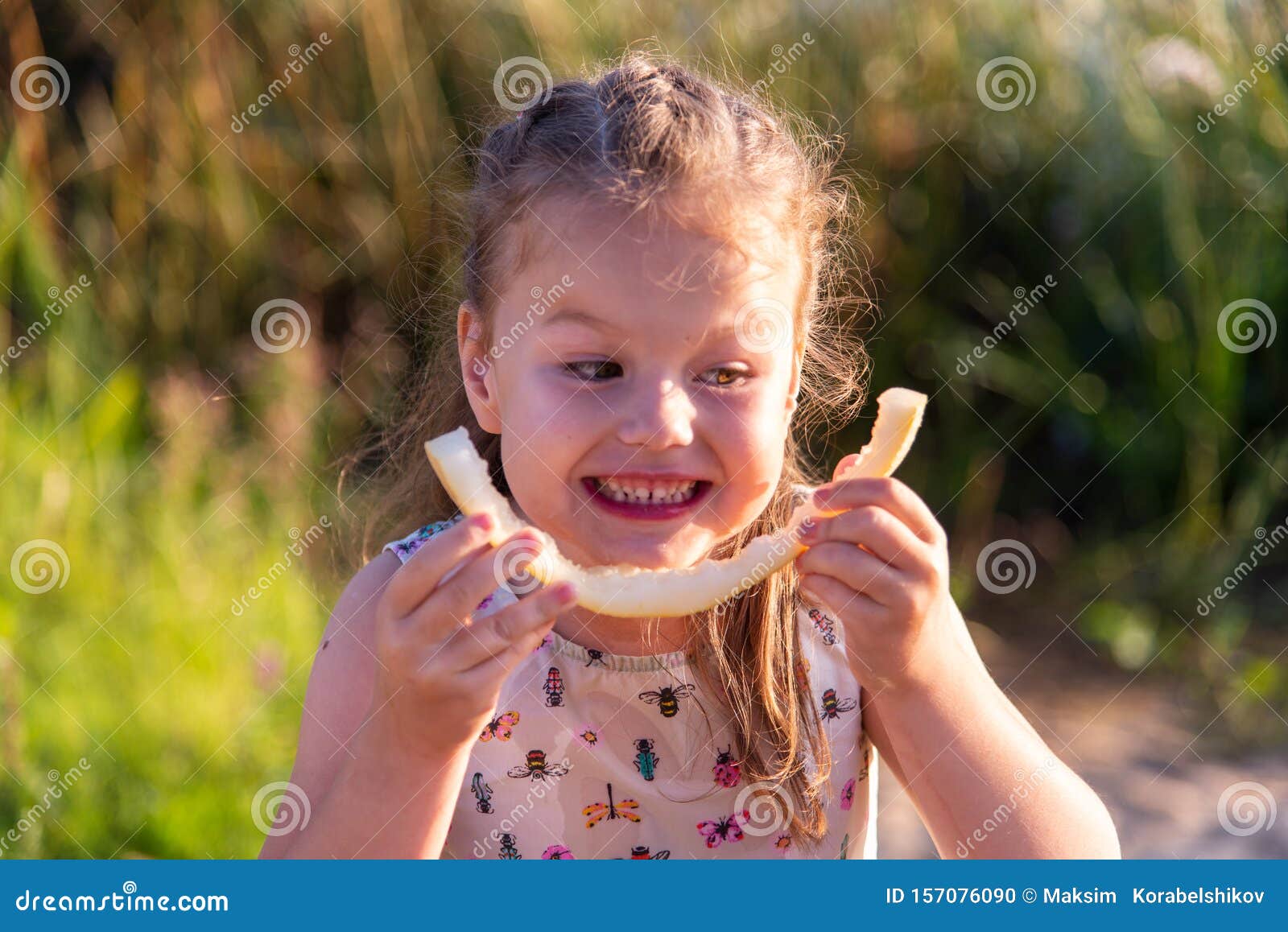 Cute Kid Eating Melon.have Fun and Grimaces Stock Photo - Image of ...