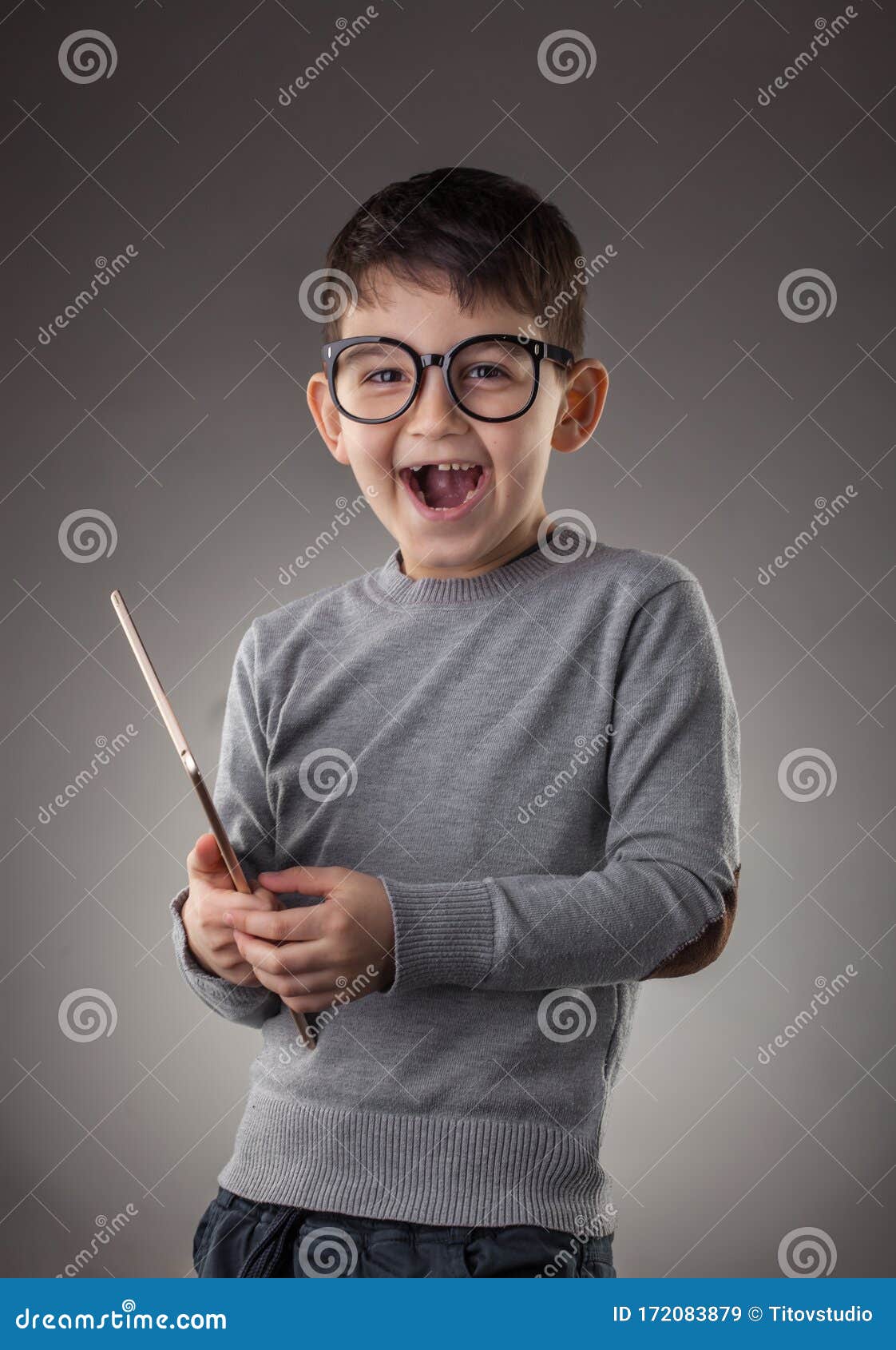 Cute Boy with Electronic Tablet on the Gray Background Stock Image ...
