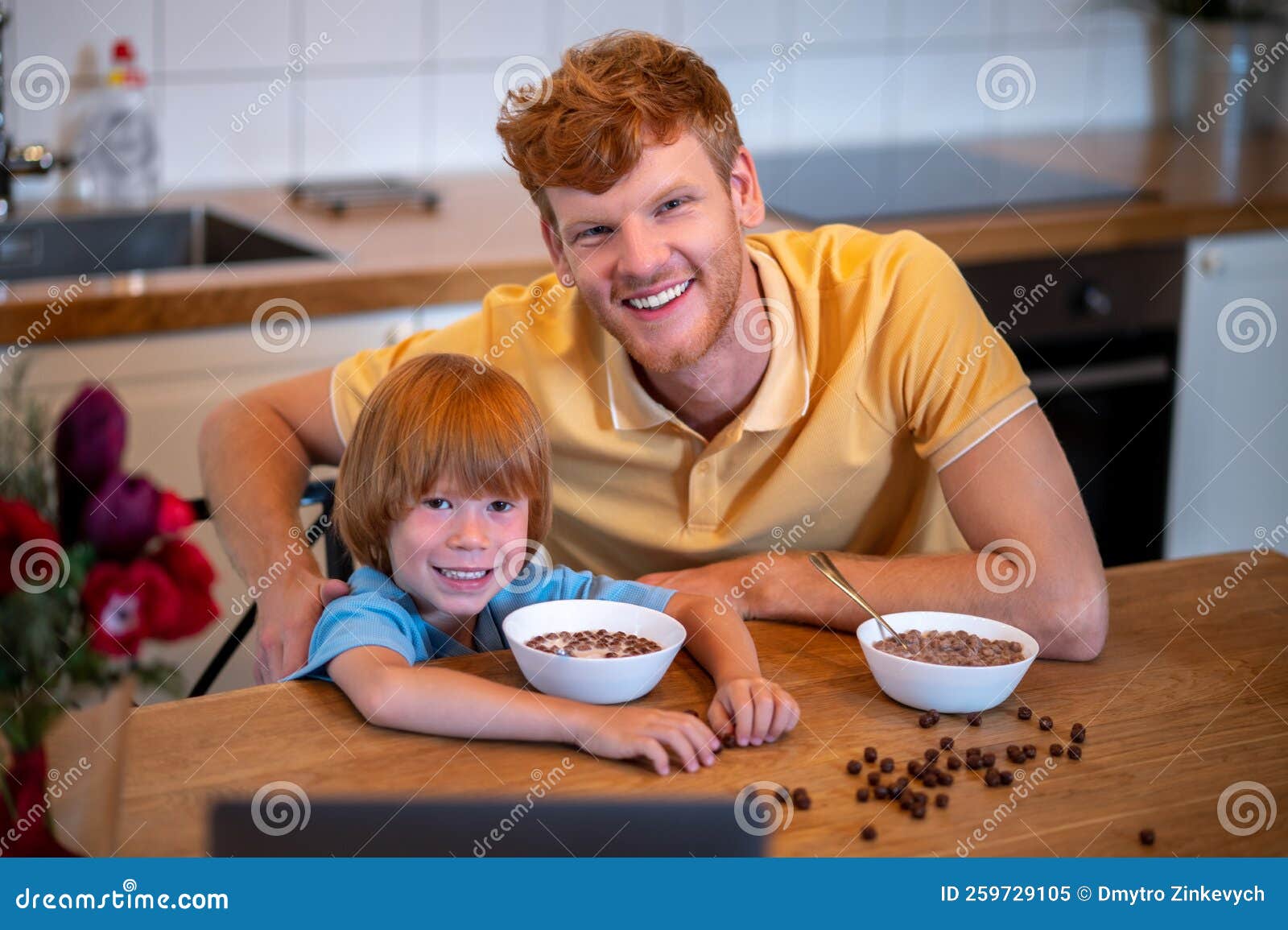 Cute Kid and His Father Eating Breakfast and Talking Stock Image ...