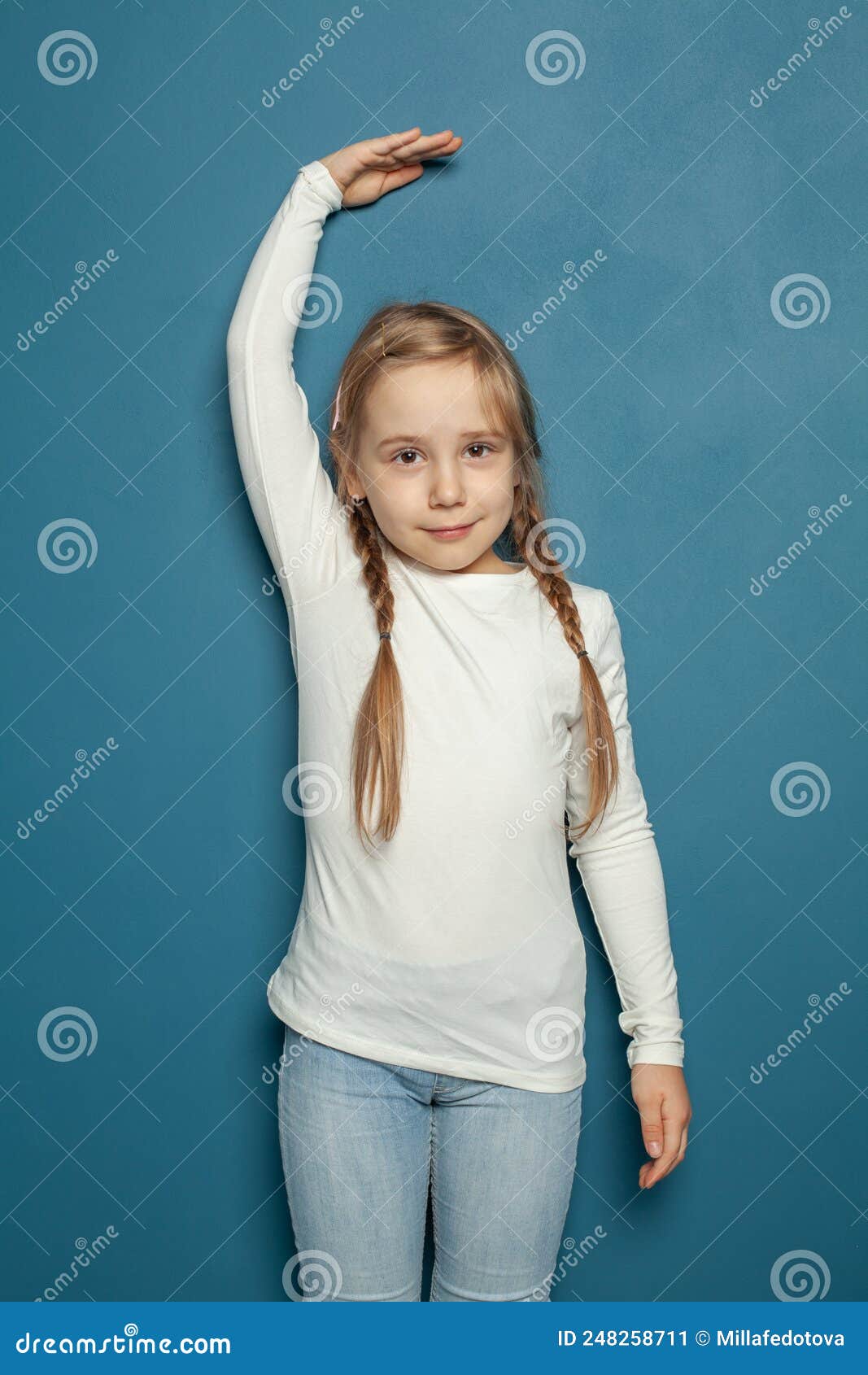 Cute Kid Holding Hand Up and Measuring the Growth on Blue Background ...