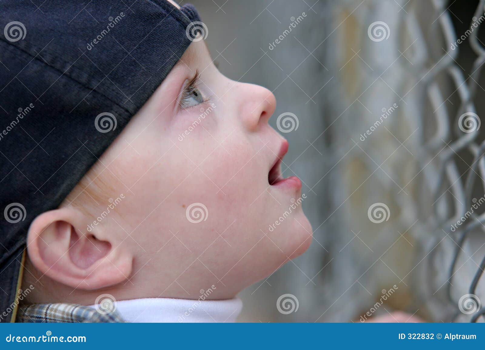 Cute kid looking up in awe stock photo. Image of person - 322832