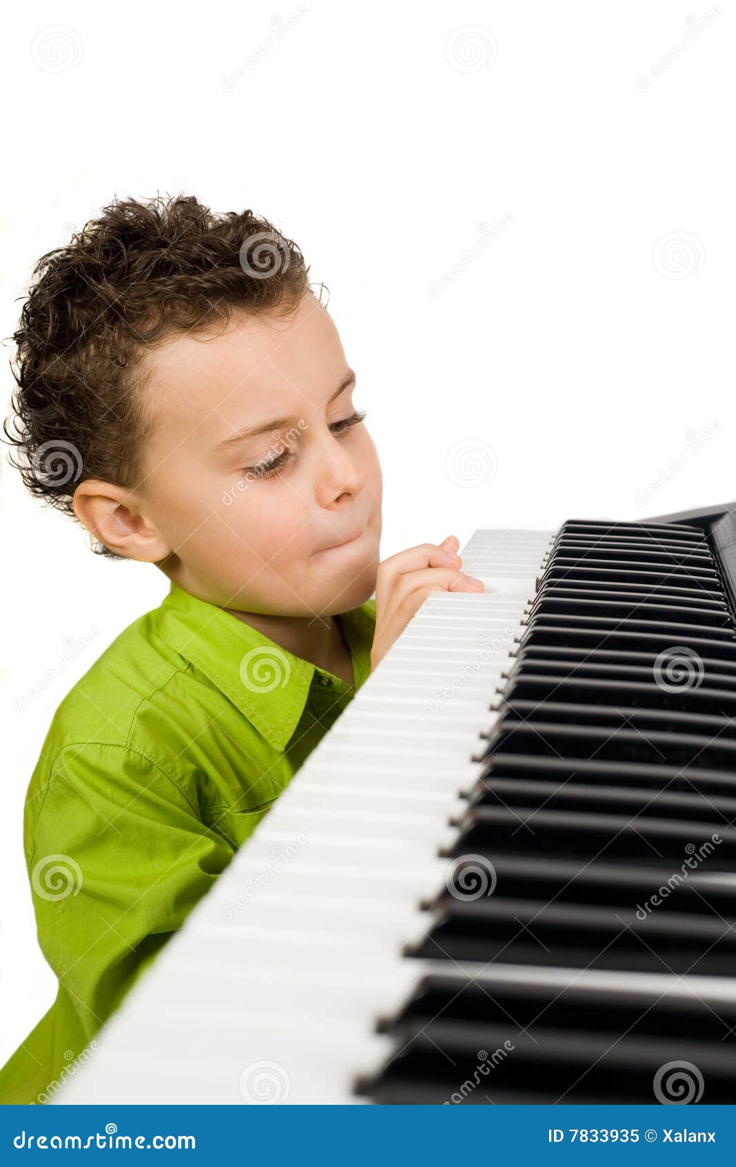 Cute kid playing piano stock image. Image of artistic - 7833935