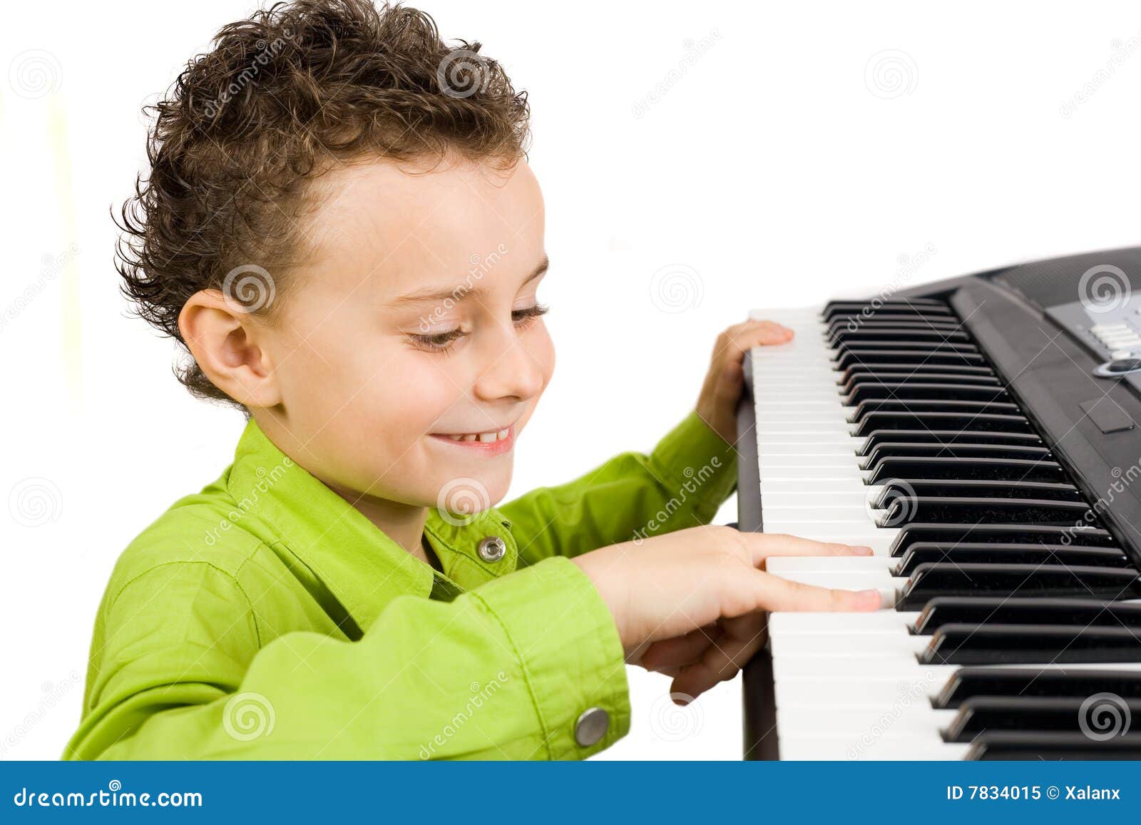 Cute kid playing piano stock image. Image of composing - 7834015