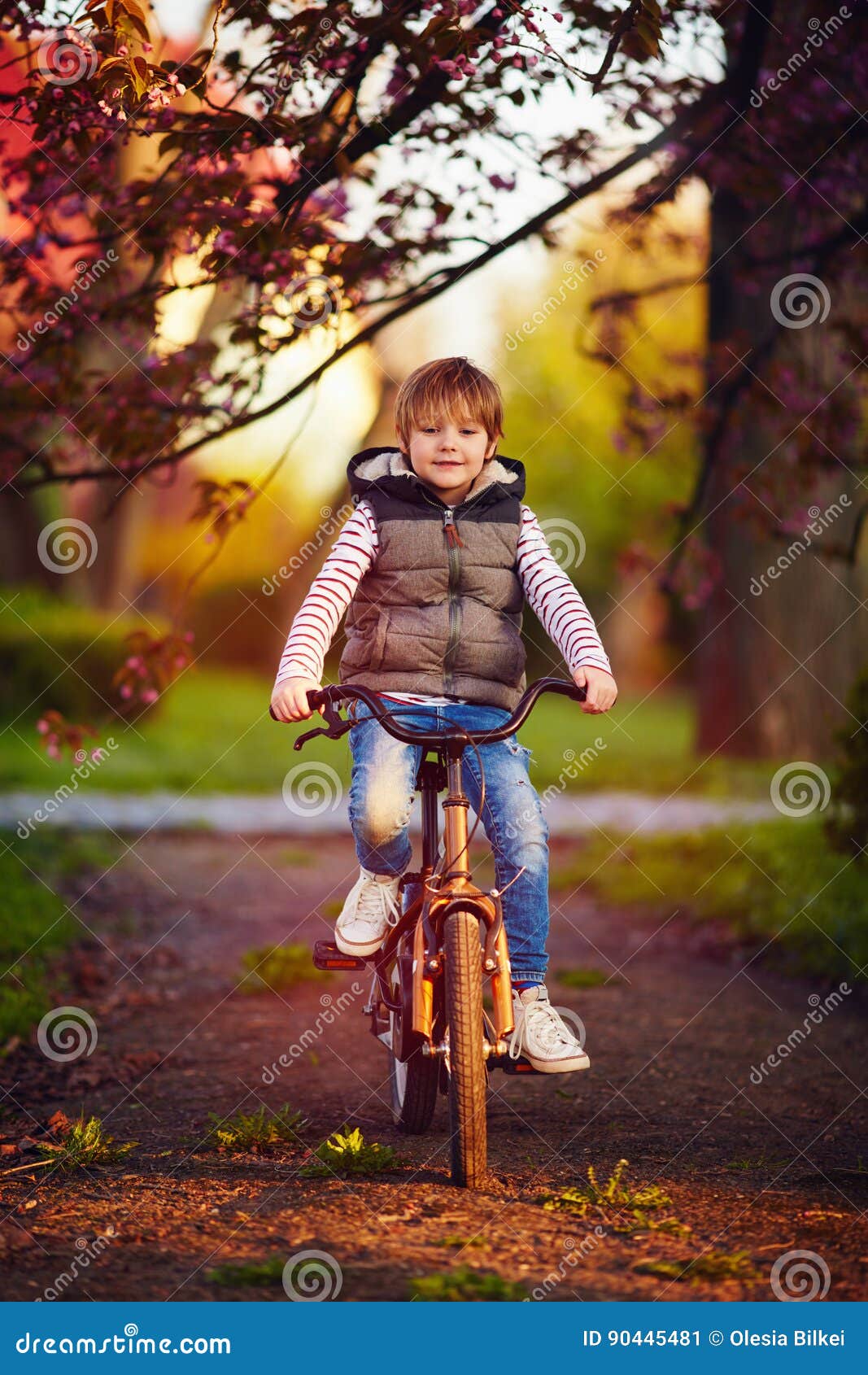 Cute Kid Riding a Bicycle through the Spring Park Stock Image - Image ...