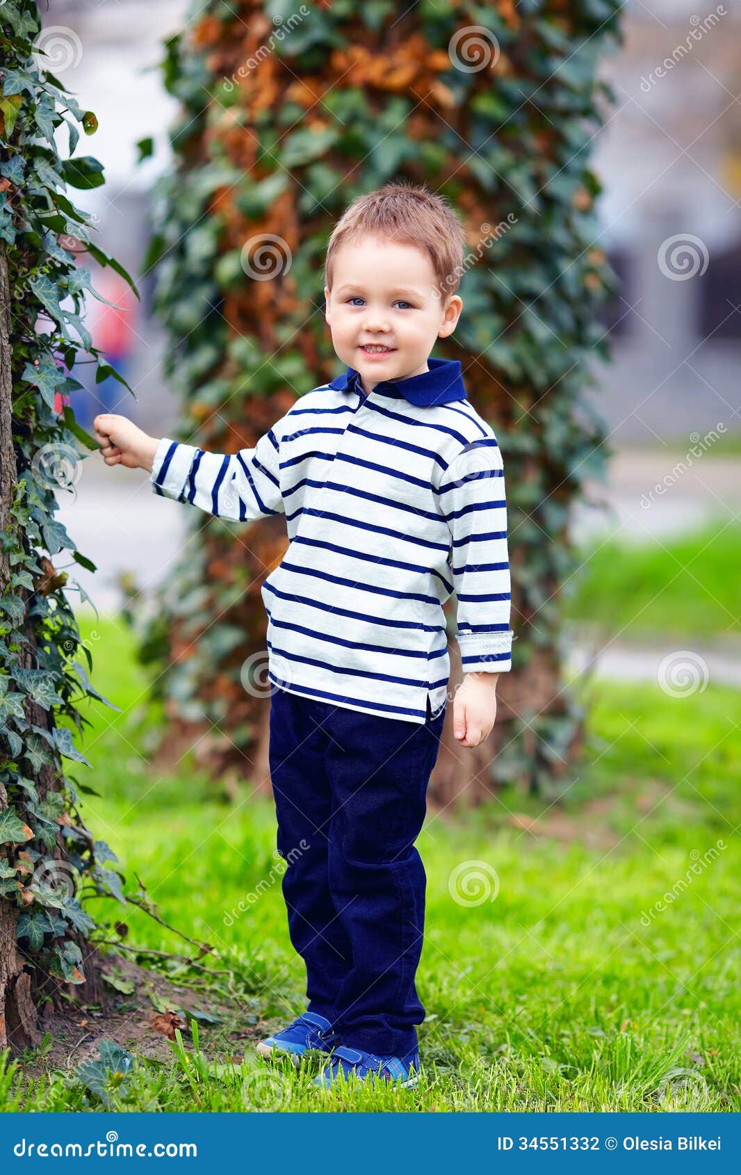 Cute Kid Standing Near the Spring Tree Stock Photo - Image of casual ...