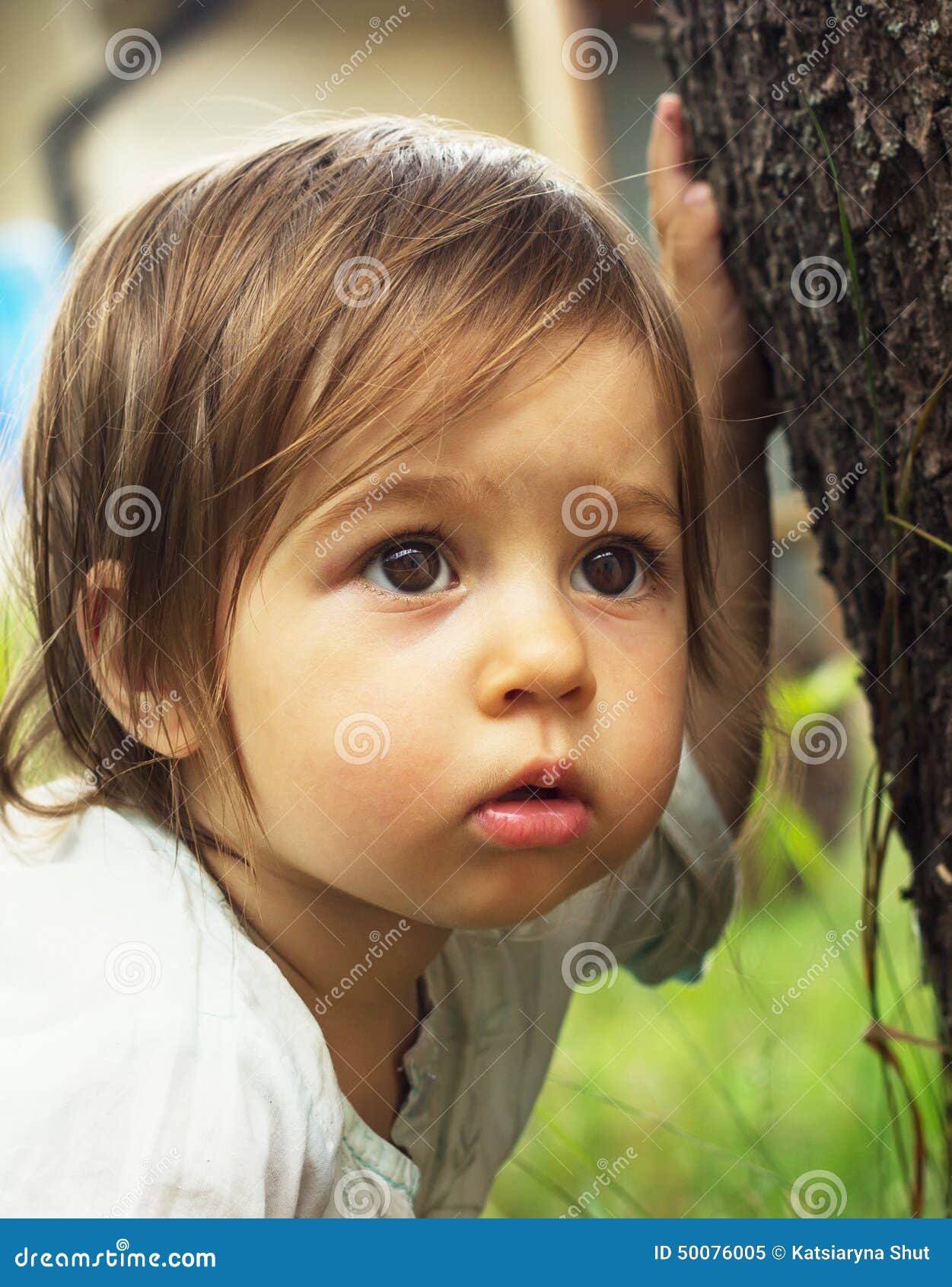 Cute kid thinking outdoors stock image. Image of cheeky - 50076005