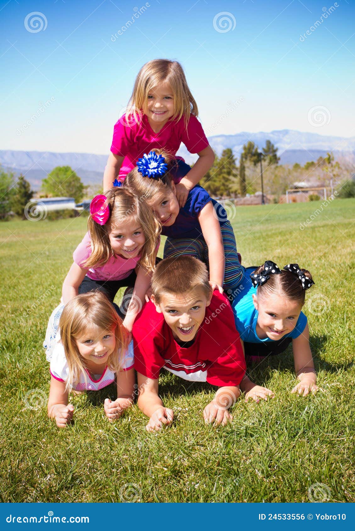 Cute Kids Building a Human Pyramid Stock Photo - Image of picnic ...