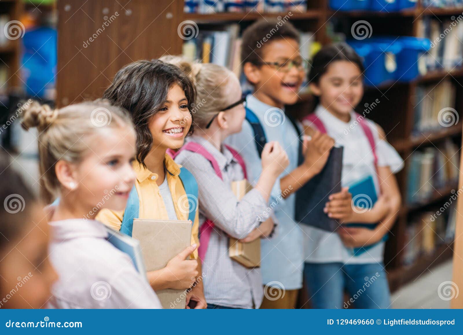 Cute kids in library stock photo. Image of female, cute - 129469660