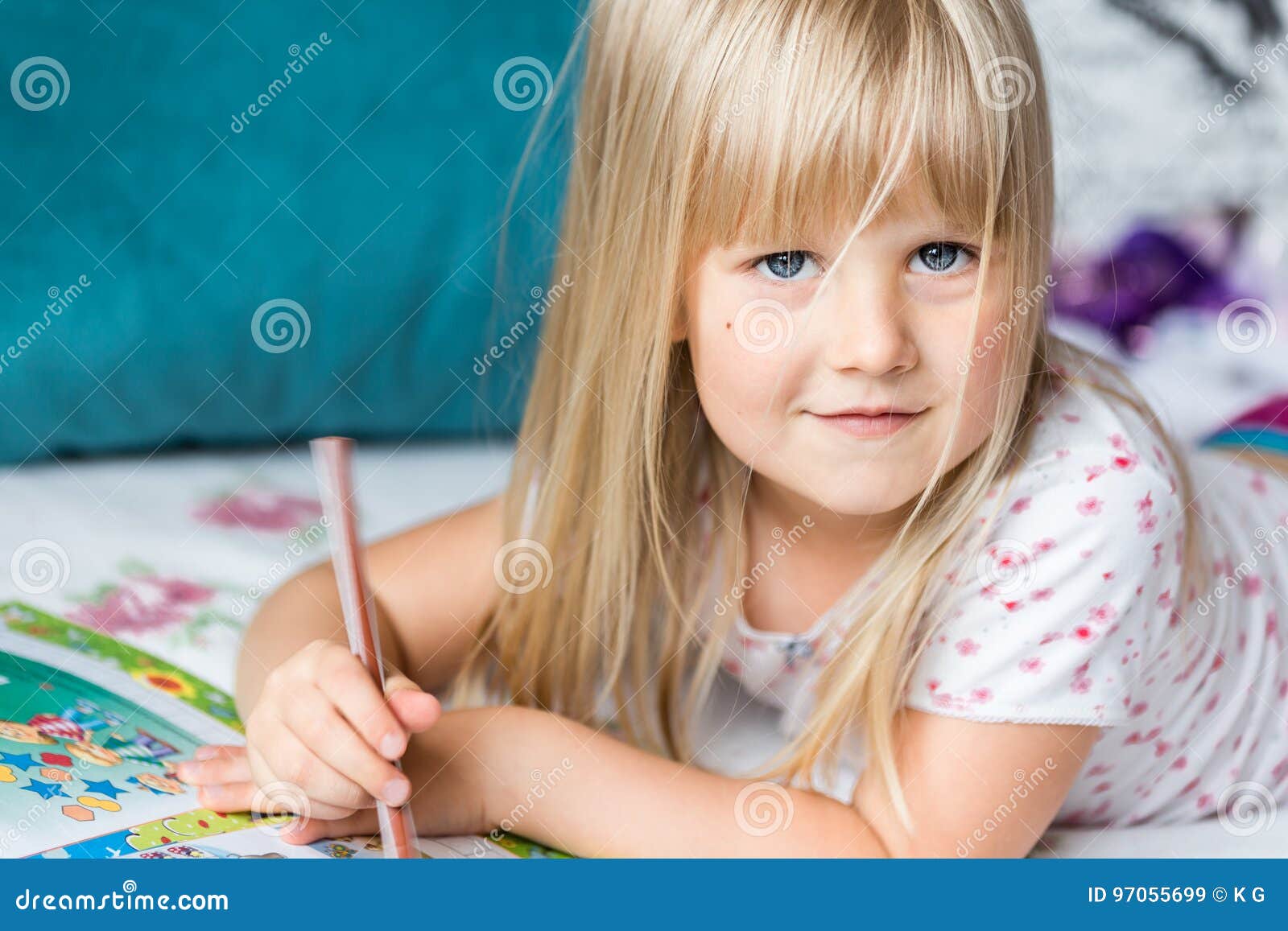 Cute Liitle Blonde Girl Lying On A Bed And Making Homework Stock Image Image Of Girl Happy