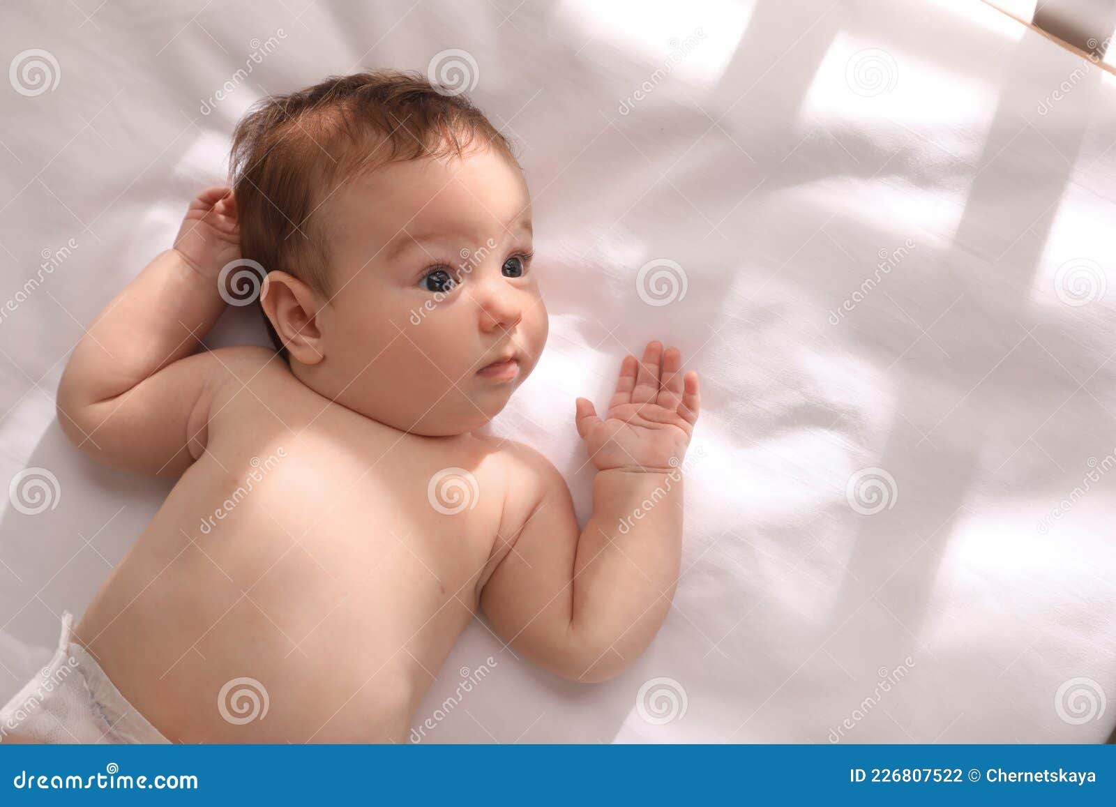 Cute baby on bed, top view stock photo. Image of happy - 226807522