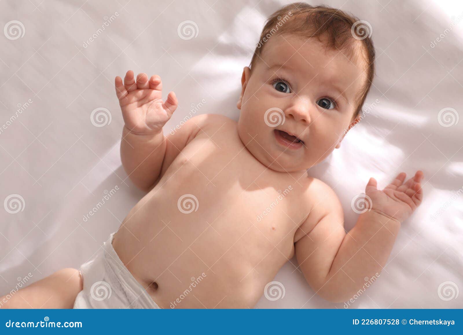Cute baby on bed, top view stock photo. Image of caucasian - 226807528