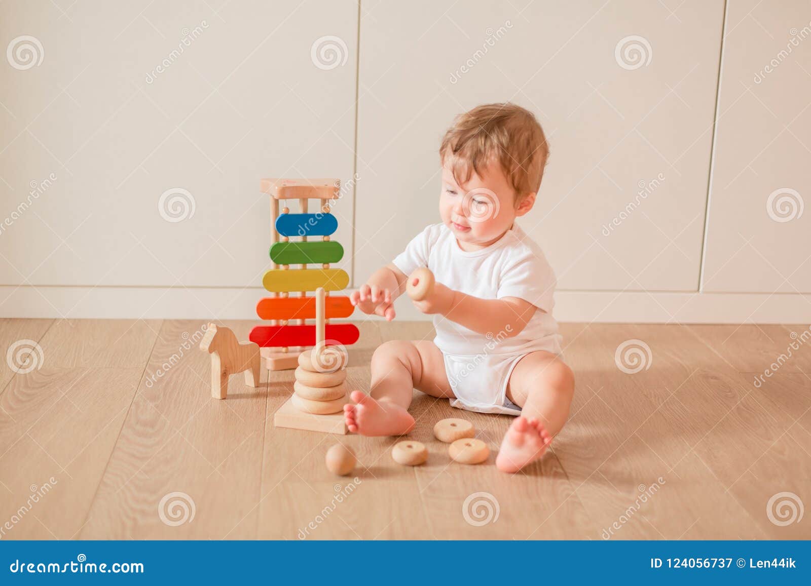 Cute Little Baby Boy Playing with Stacking Rings Stock Image - Image of ...