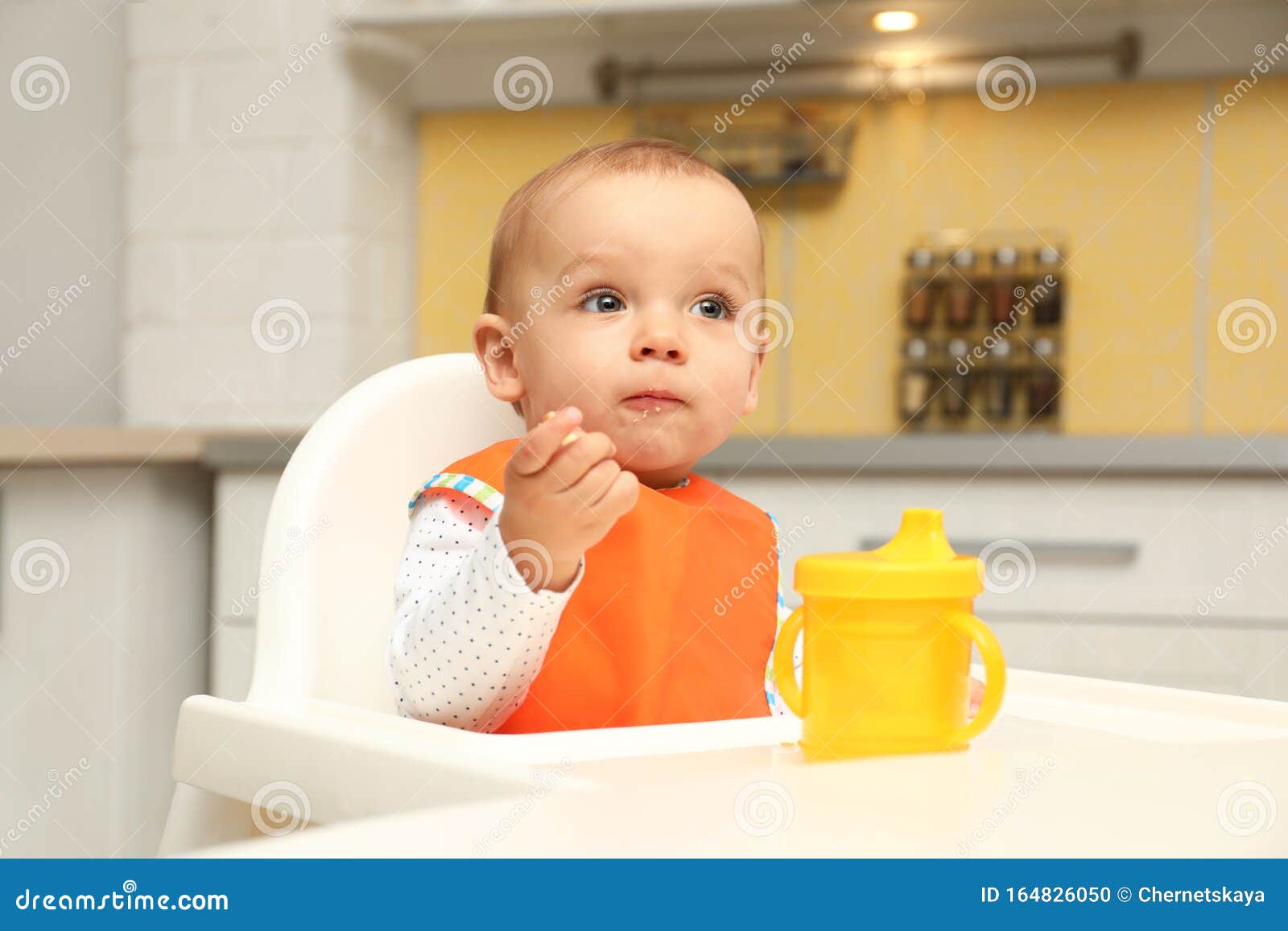 Cute Little Baby Eating Cookie Stock Photo - Image of home, adorable ...