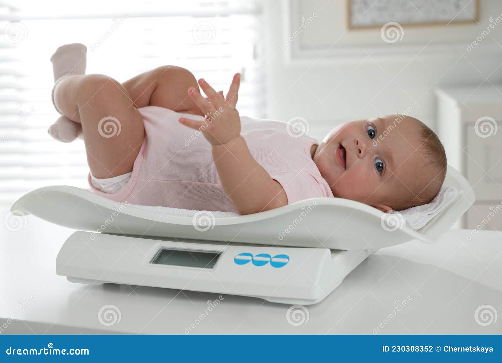 Cute Little Baby Lying on Scales at Home Stock Photo - Image of growth ...