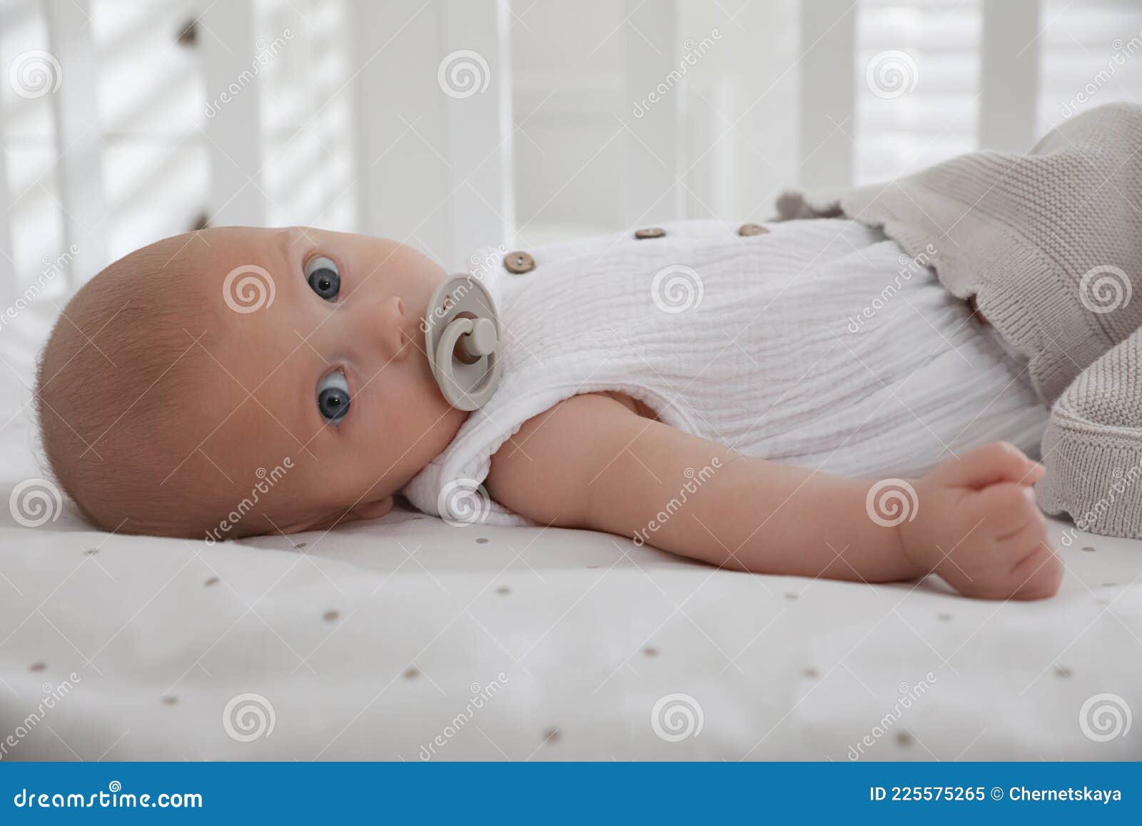 Cute Little Baby with Pacifier Lying on Bed Stock Image - Image of ...