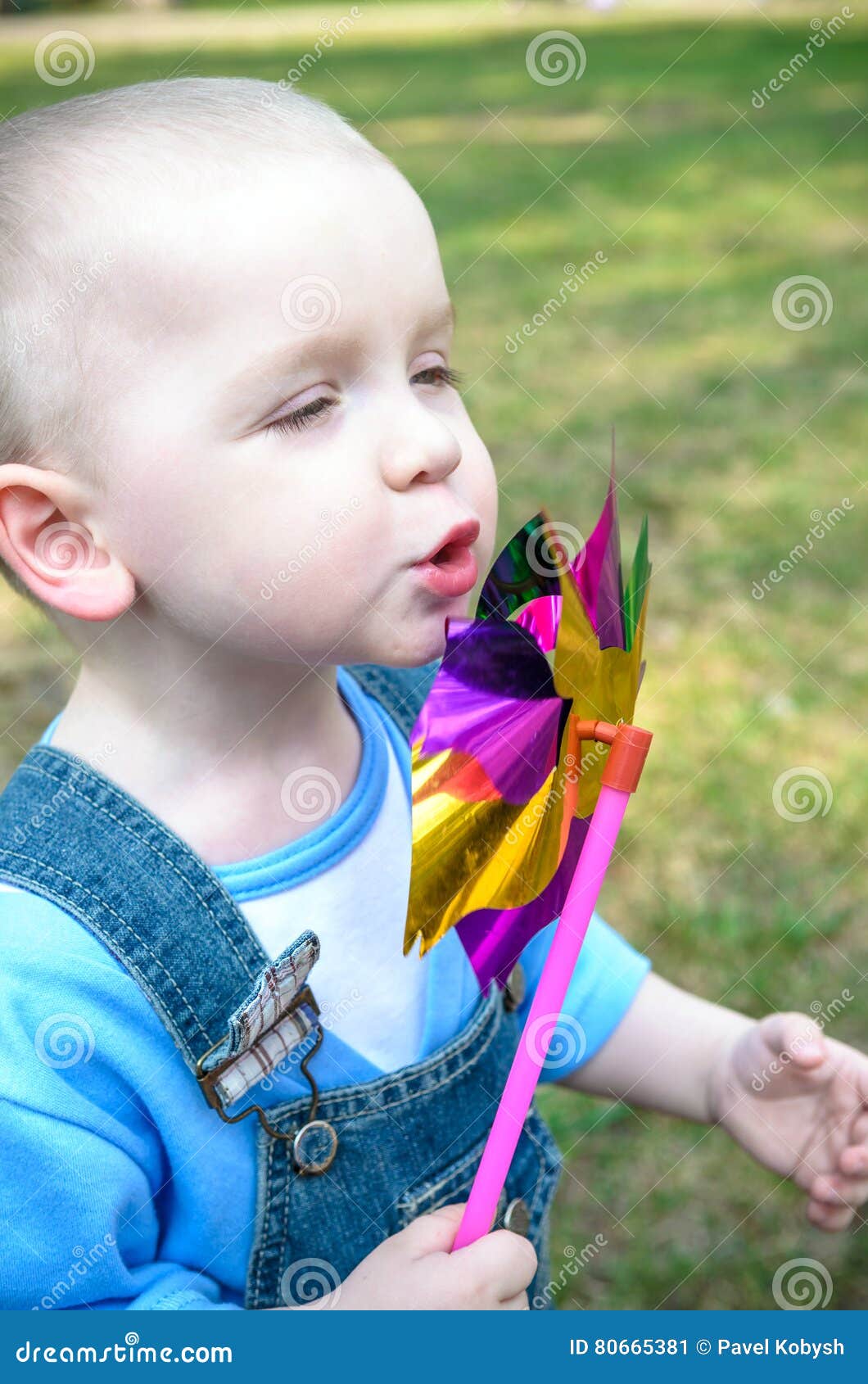 Cute Little Boy Blowing on a Pinwheel Stock Image - Image of cute, love ...
