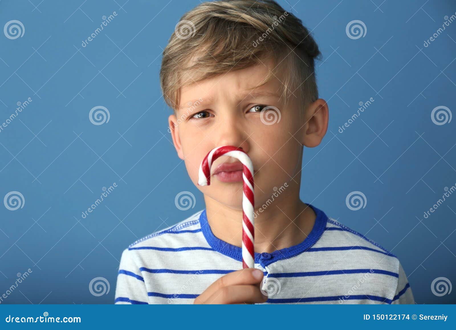Cute Little Boy with Candy Cane on Color Background Stock Photo - Image ...