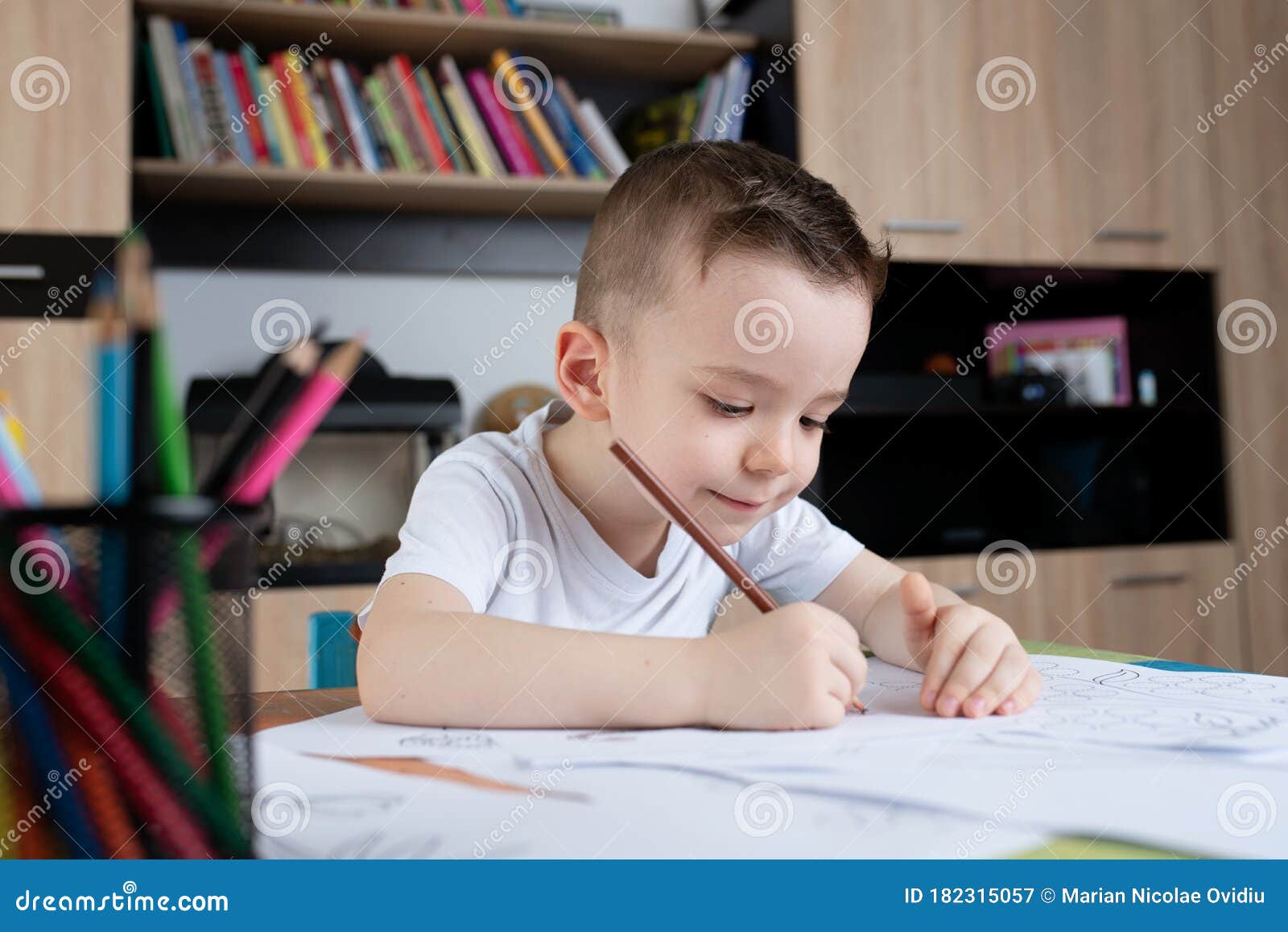 Cute Little Boy Coloring Sitting at His Playing Table Stock Image ...