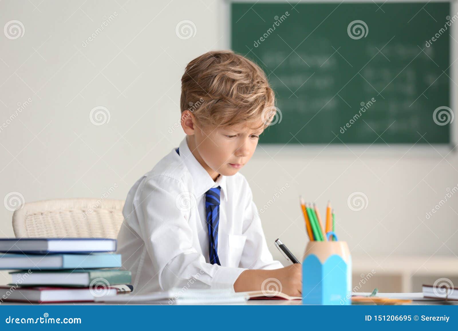 Cute Little Boy Doing Homework in Classroom Stock Image - Image of cute ...