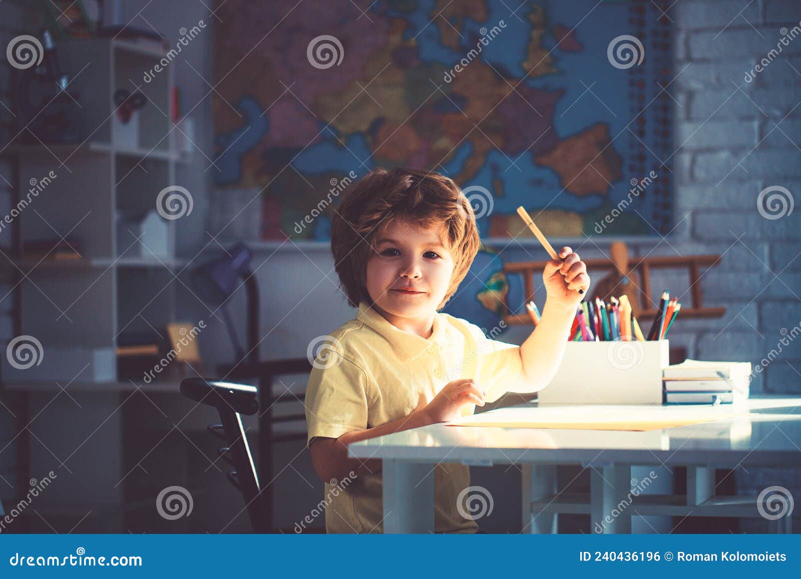 Cute Little Boy Drawing at Desk at the Nursery School. Stock Photo ...