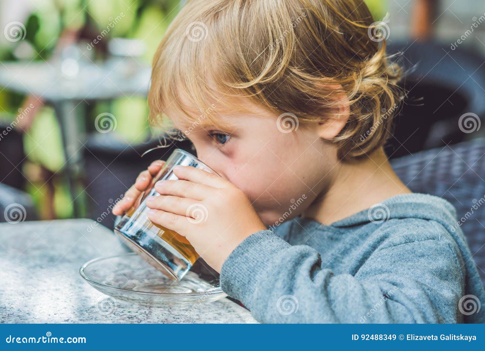 Cute Little Boy Drinking Tea in Cafeteria Stock Image - Image of ...