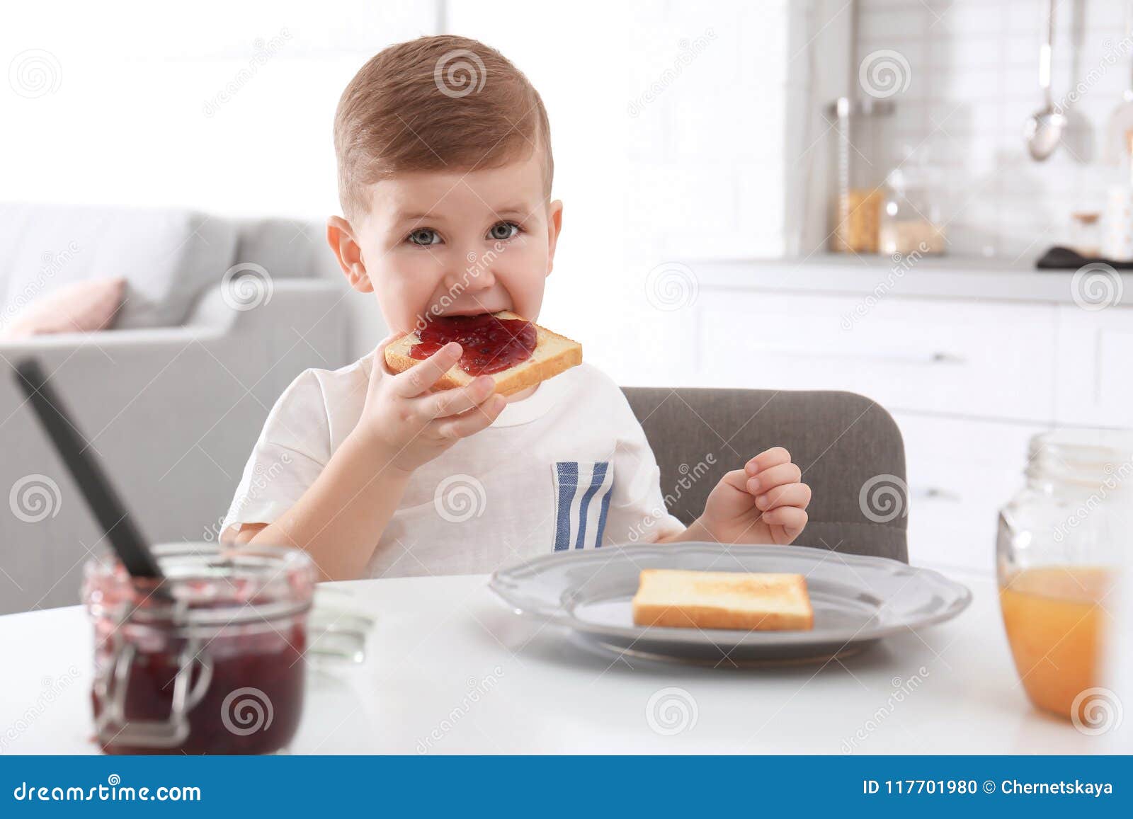 Cute Little Boy Eating Toast with Sweet Jam Stock Photo - Image of ...