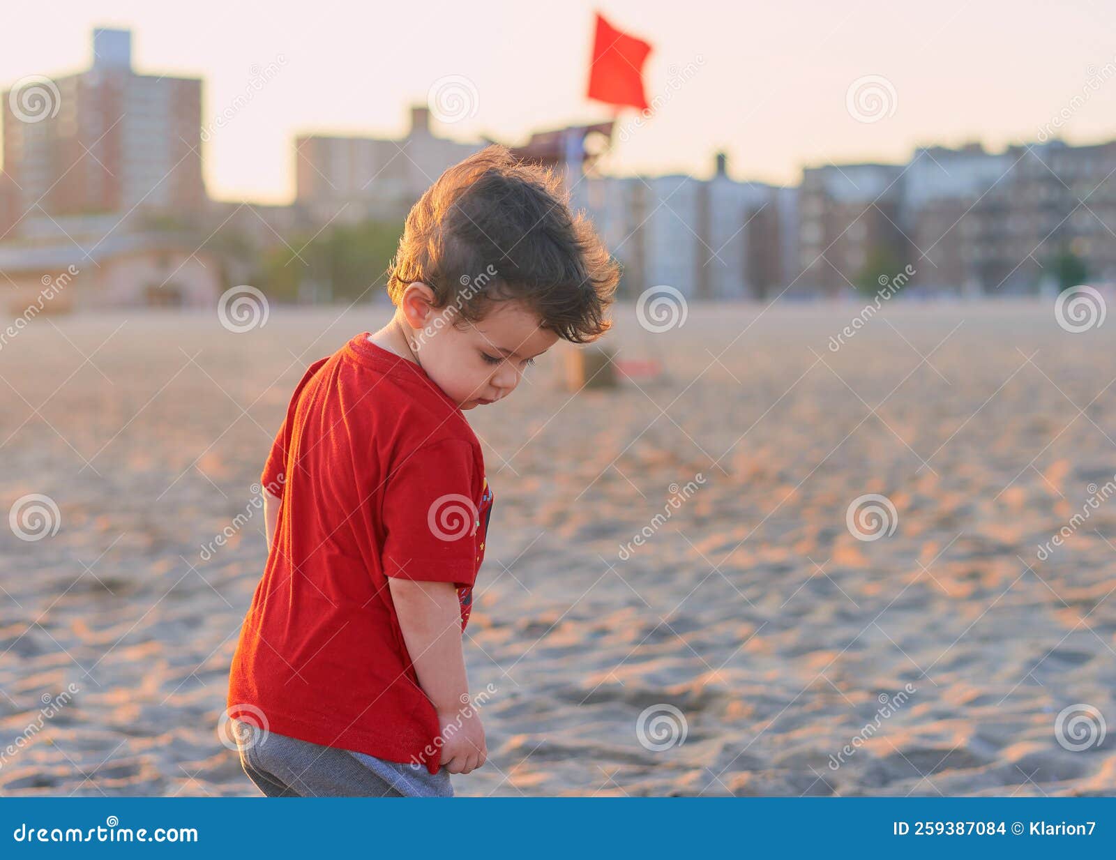 Young Toddler Exploring the Beach at Sunset Stock Photo - Image of ...