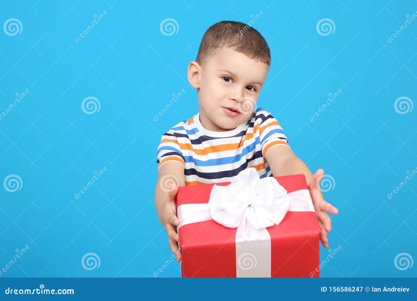 Little boy with gift box stock image. Image of looking - 156586247