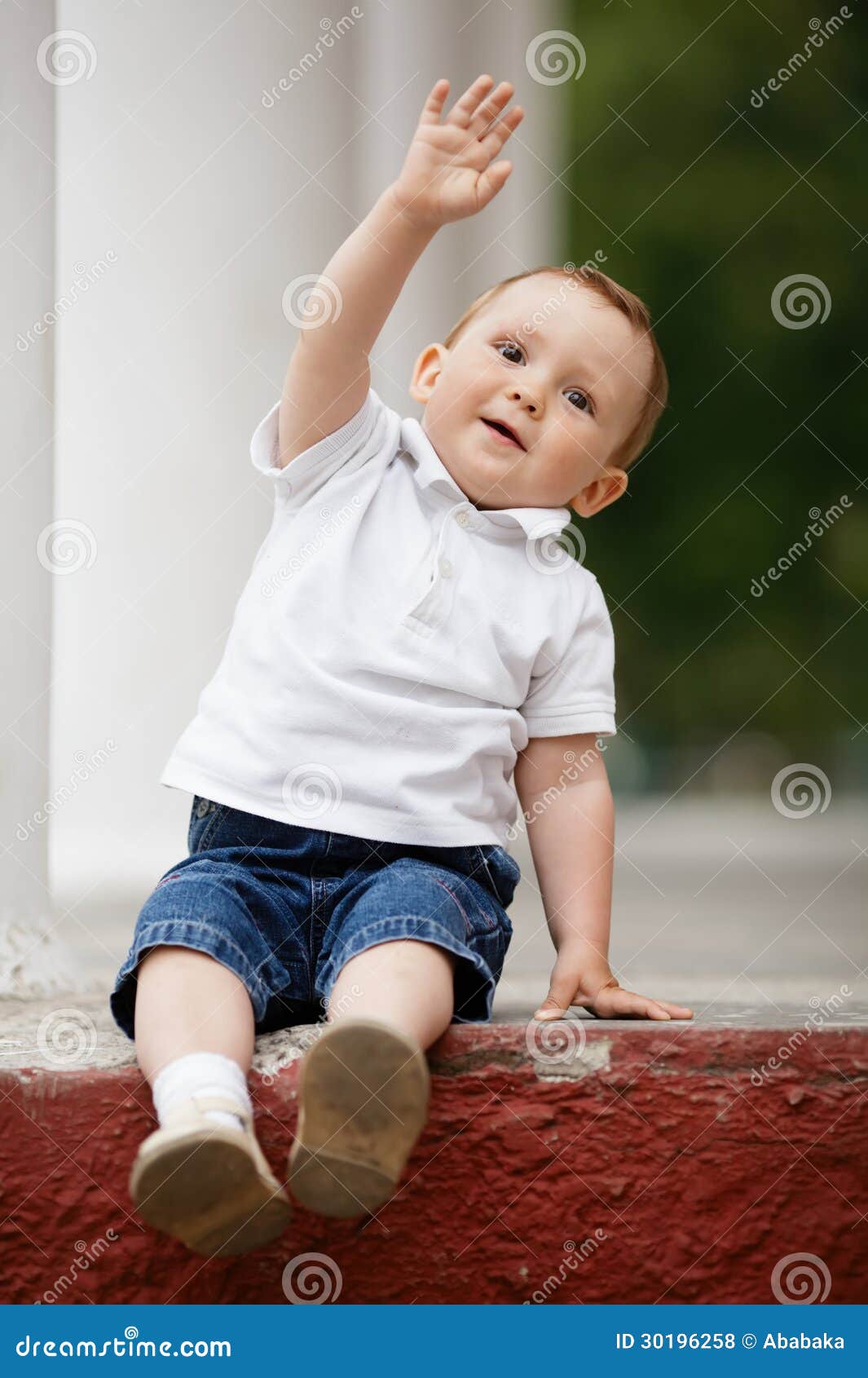 Boy with hand raised stock photo. Image of park, blue - 30196258