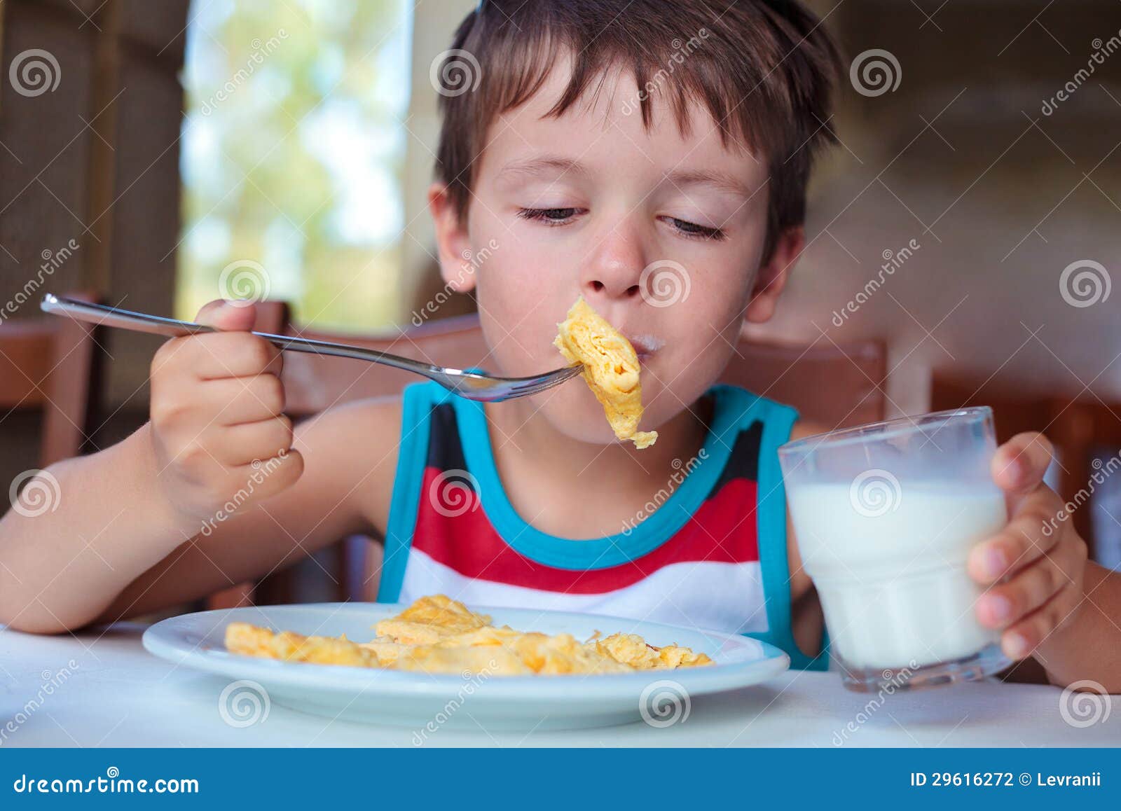 Cute Little Boy Having Delicious Breakfast Stock Photo - Image of ...