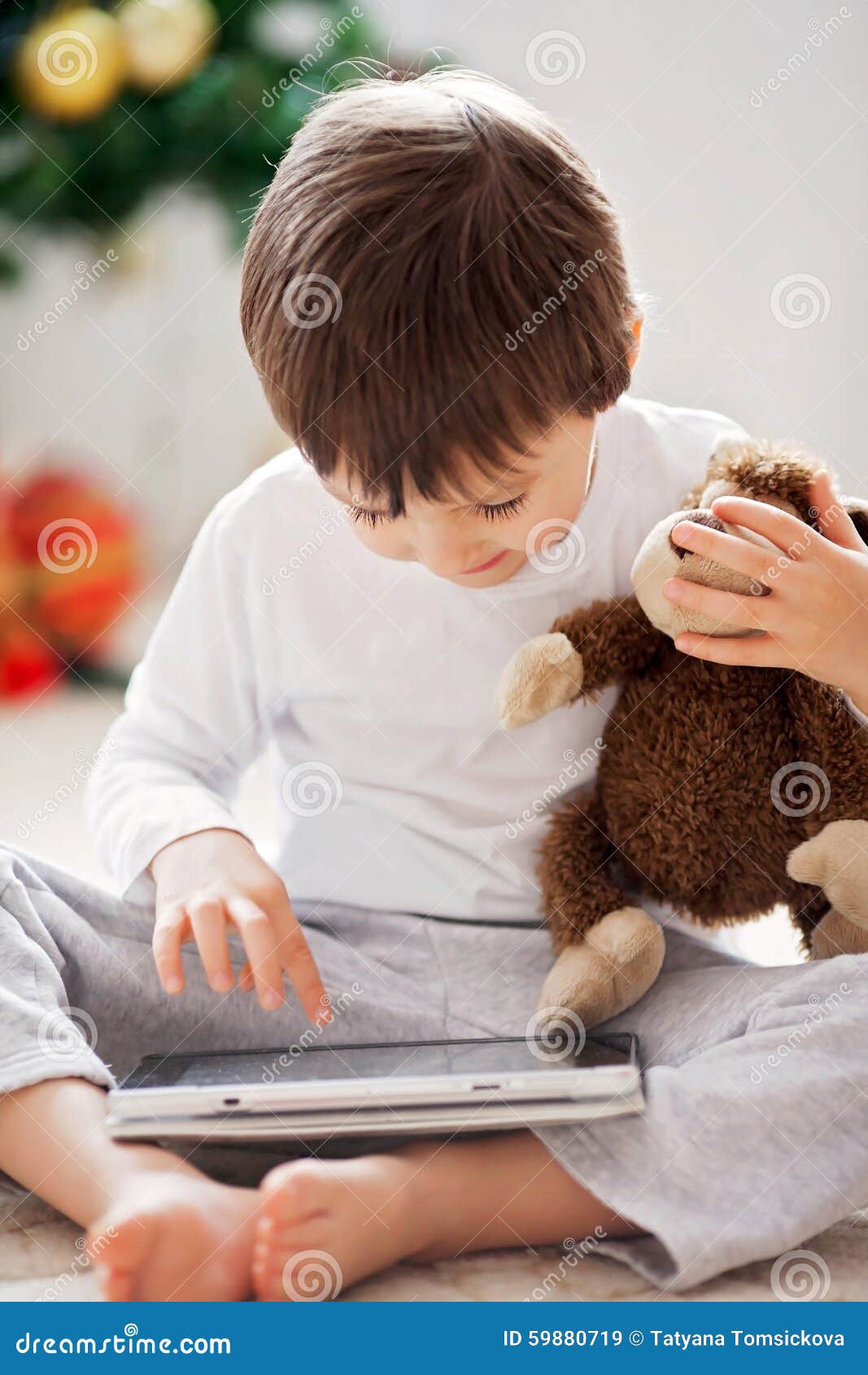Cute Little Boy and His Monkey Toy, Playing on Tablet Stock Image ...