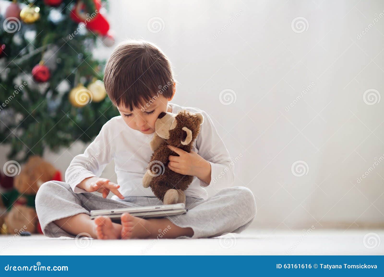 Cute Little Boy and His Monkey Toy, Playing on Tablet Stock Photo ...