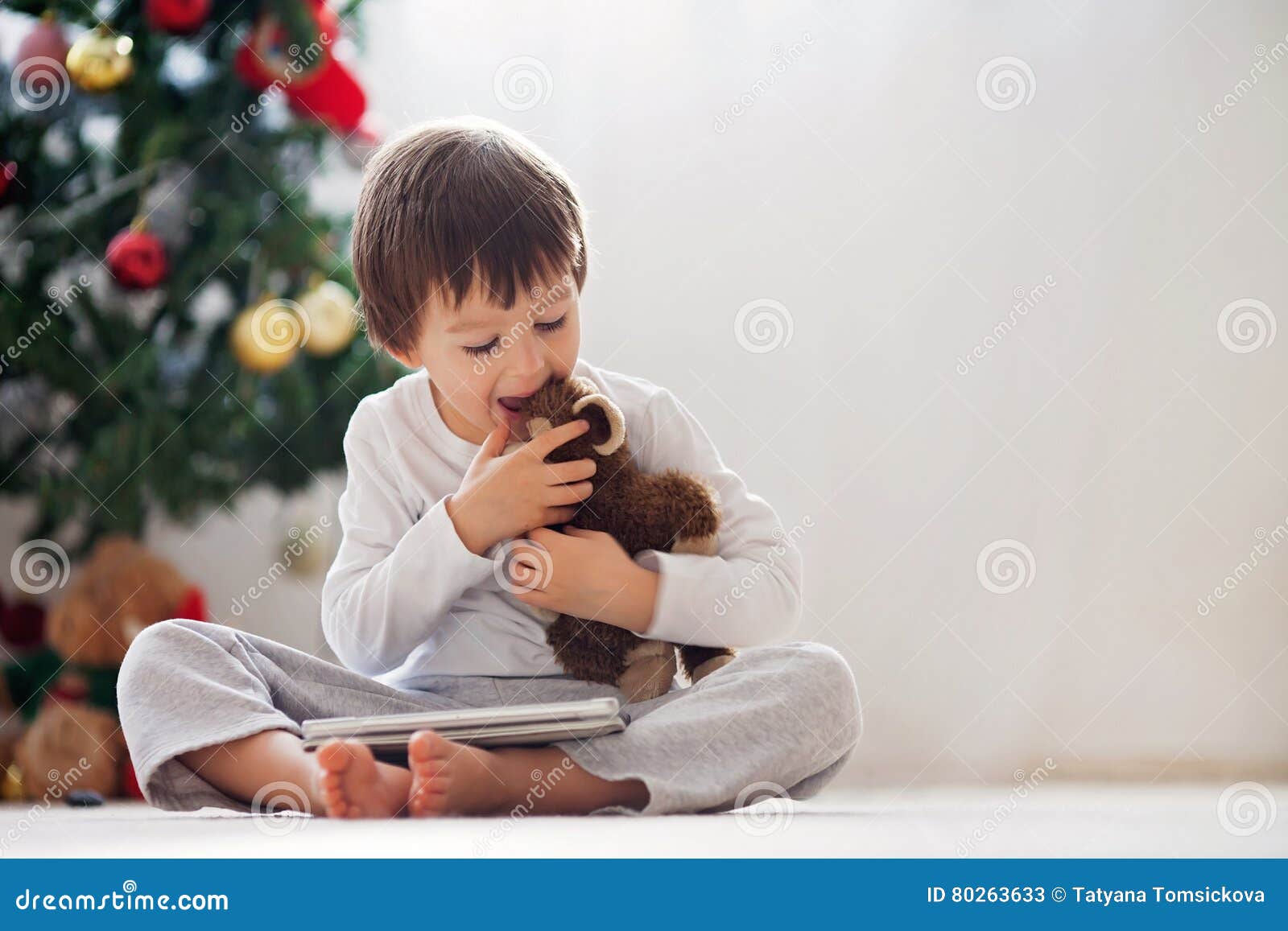 Cute Little Boy and His Monkey Toy, Playing on Tablet Stock Image ...