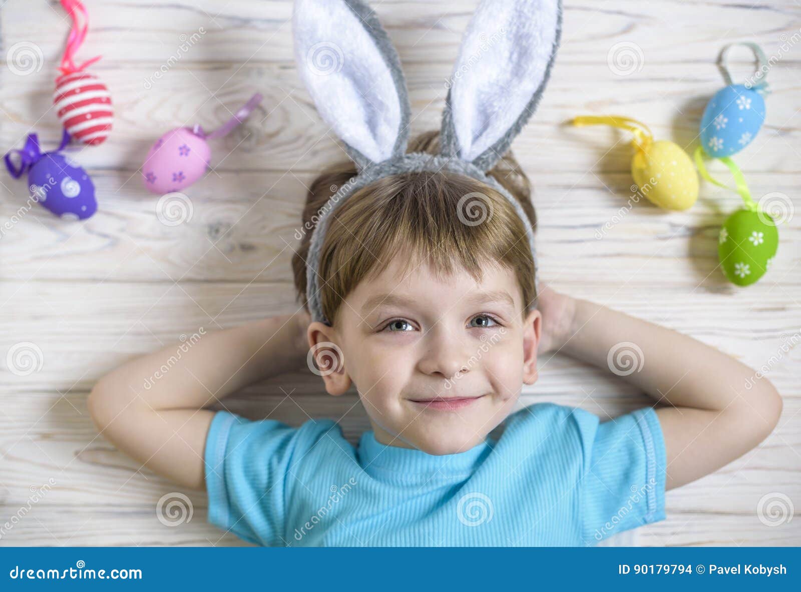 Cute Little Boy Holding a Nest with Colored Easter Eggs at Home on ...
