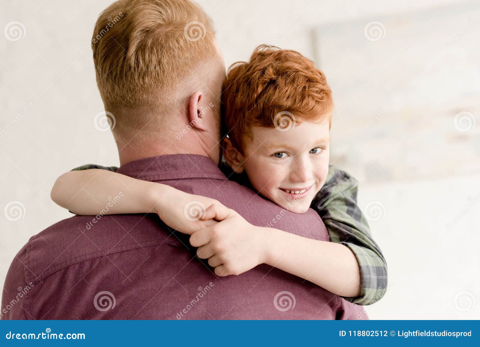 Cute Little Boy Hugging Father and Smiling Stock Photo - Image of ...