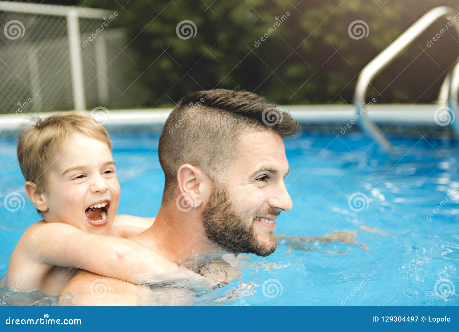 Cute Little Boy Learning To Swim with Parents in Pool Stock Image ...