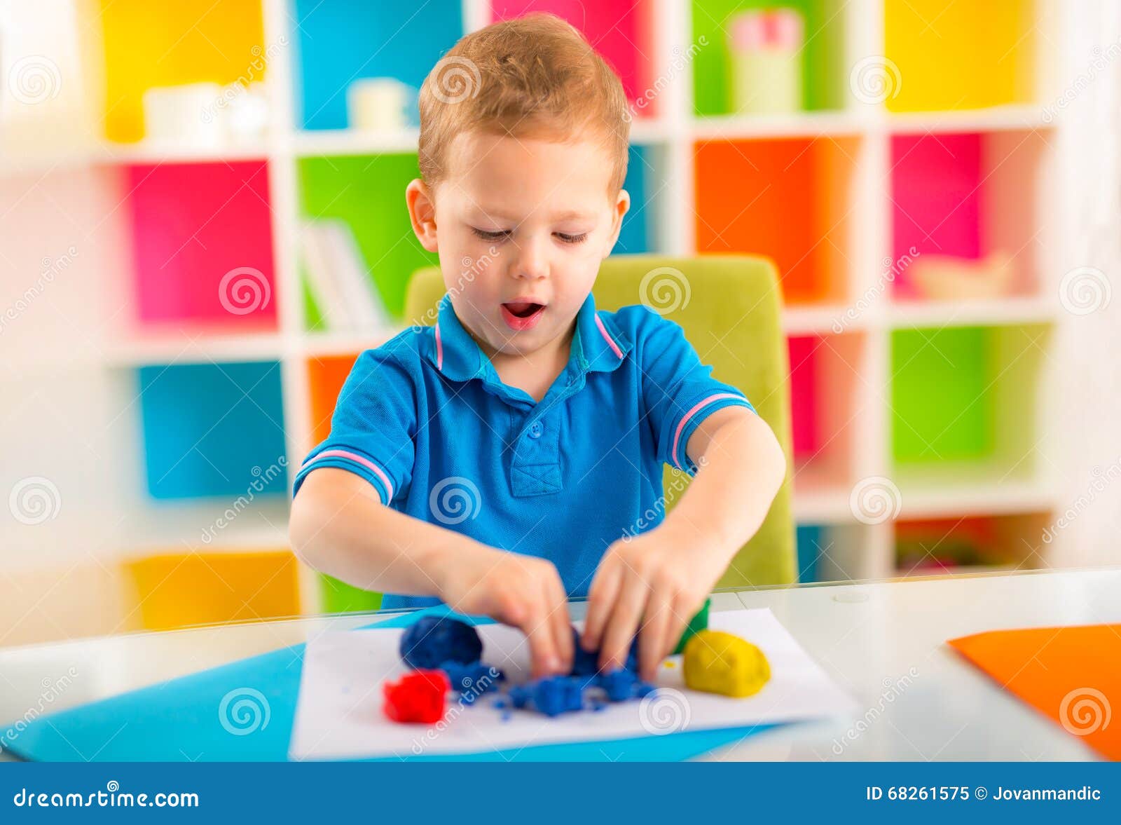 Cute Little Boy Moulds from Plasticine on Table Stock Image - Image of ...