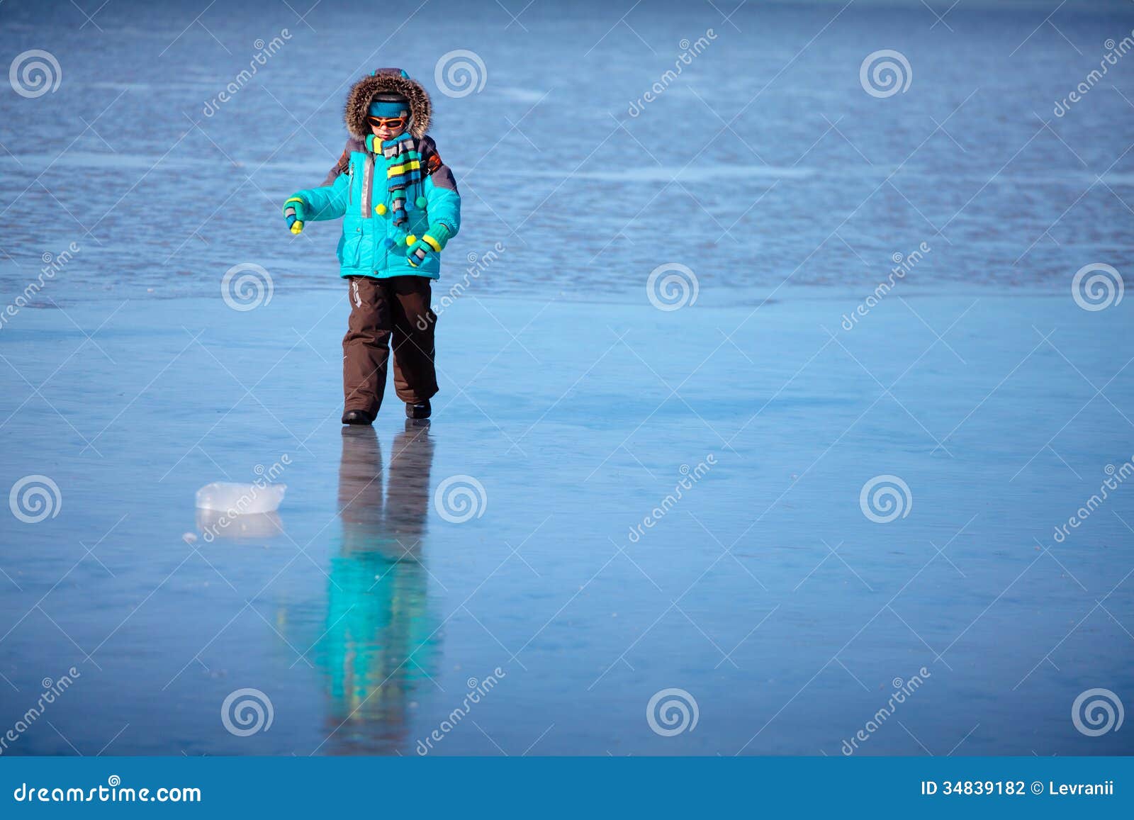 Cute Little Boy Outdoors Playing on Frozen Sea Stock Photo - Image of ...