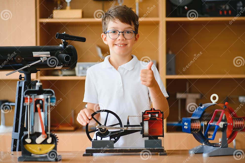 Cute Little Boy at Physics Lesson in Classroom Stock Photo - Image of ...